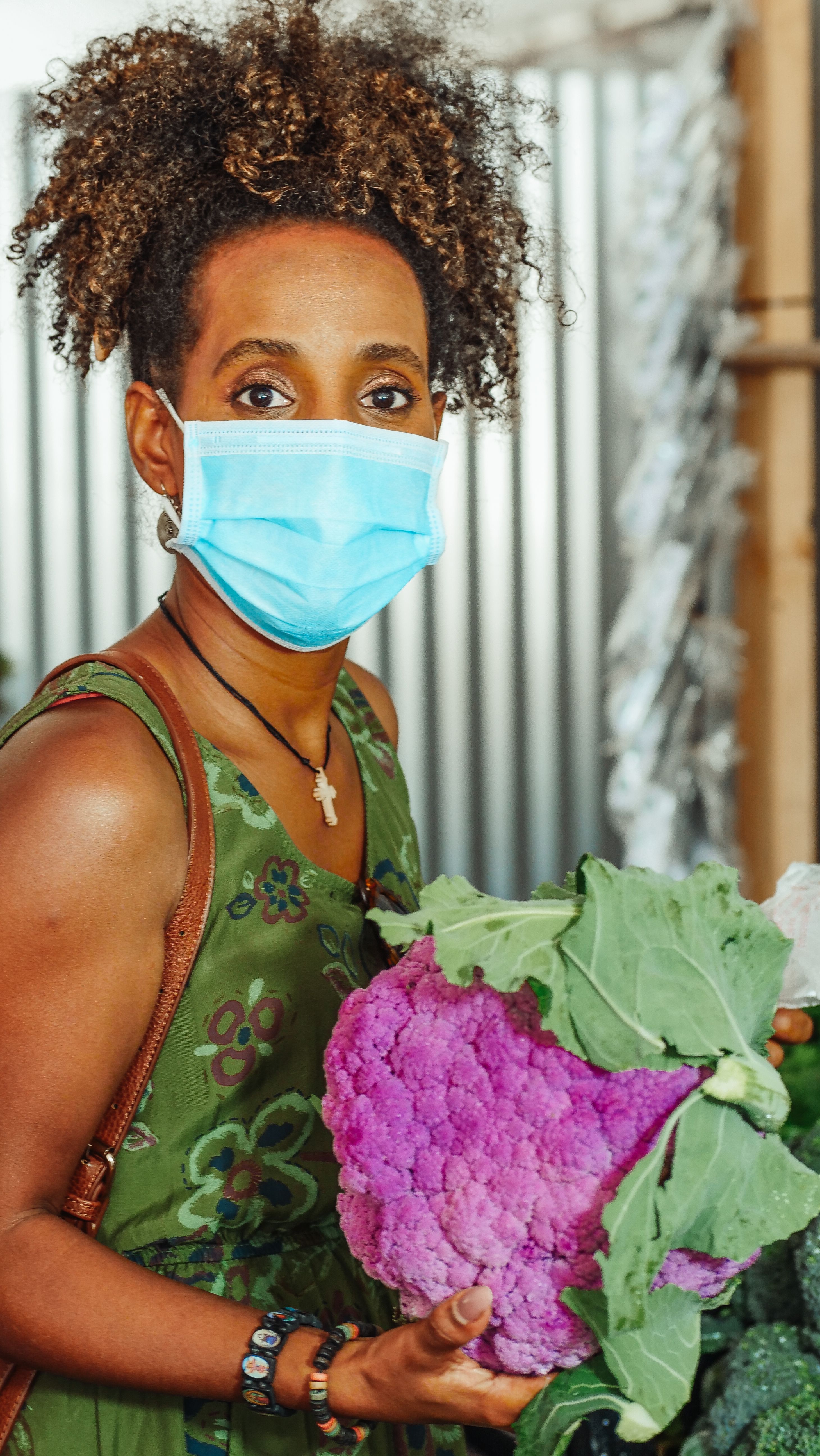 Woman Wearing a Face Mask while Holding a Cauliflower · Free Stock Photo