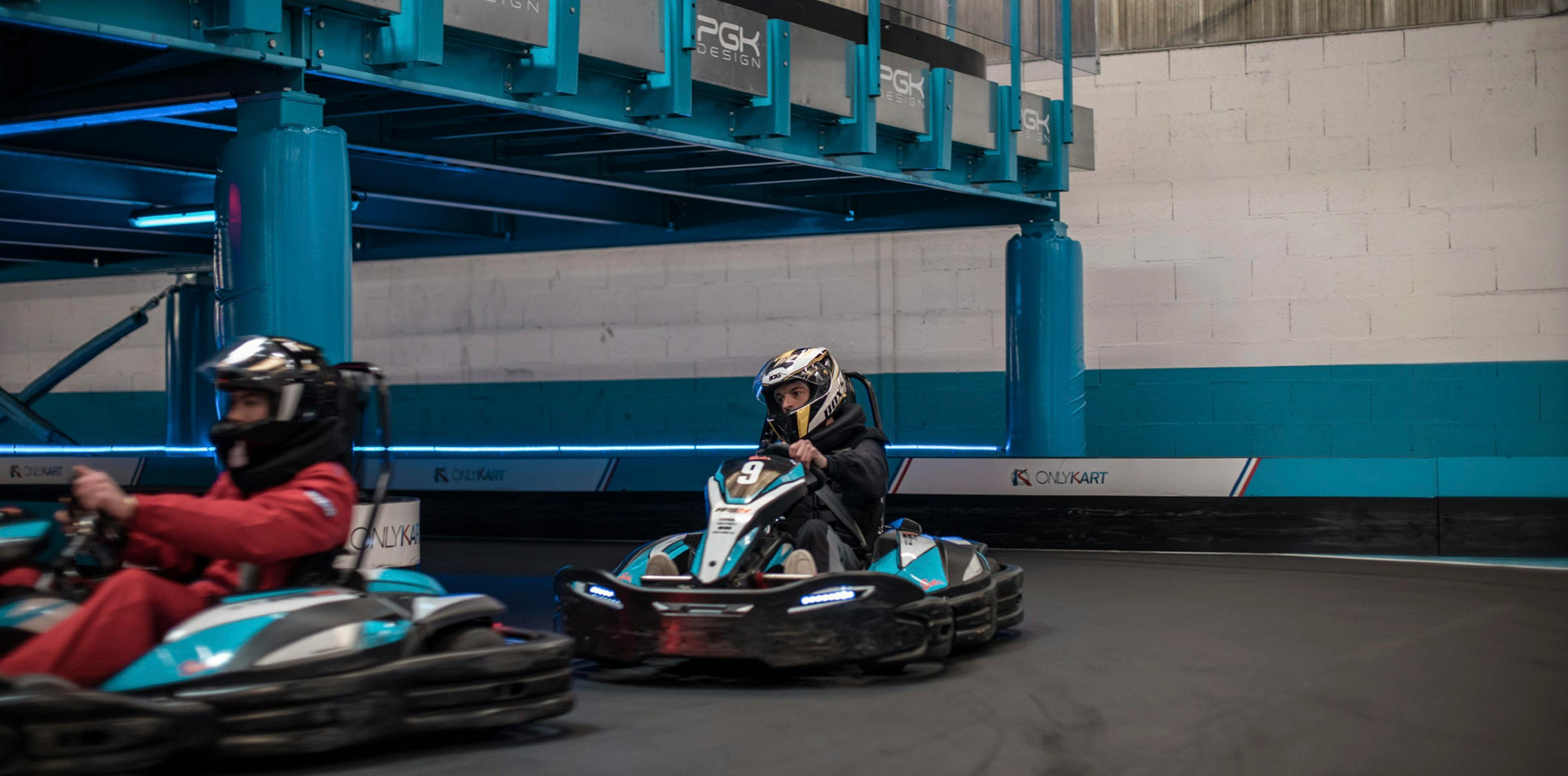 A Person Driving a Go Kart in a Racetrack · Free Stock Photo