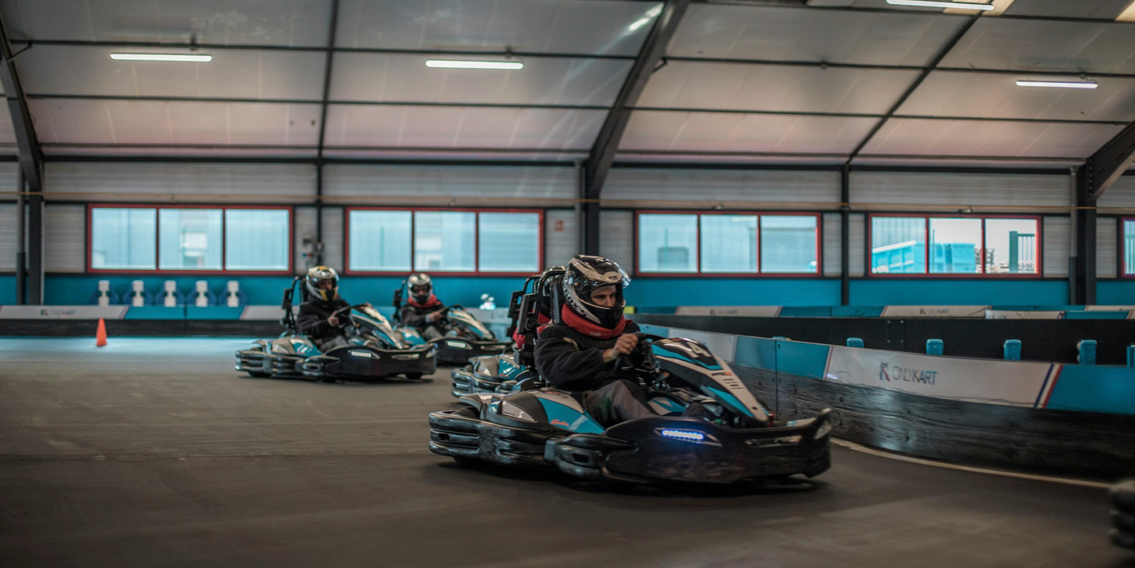 Three Men Riding on Go Karts · Free Stock Photo