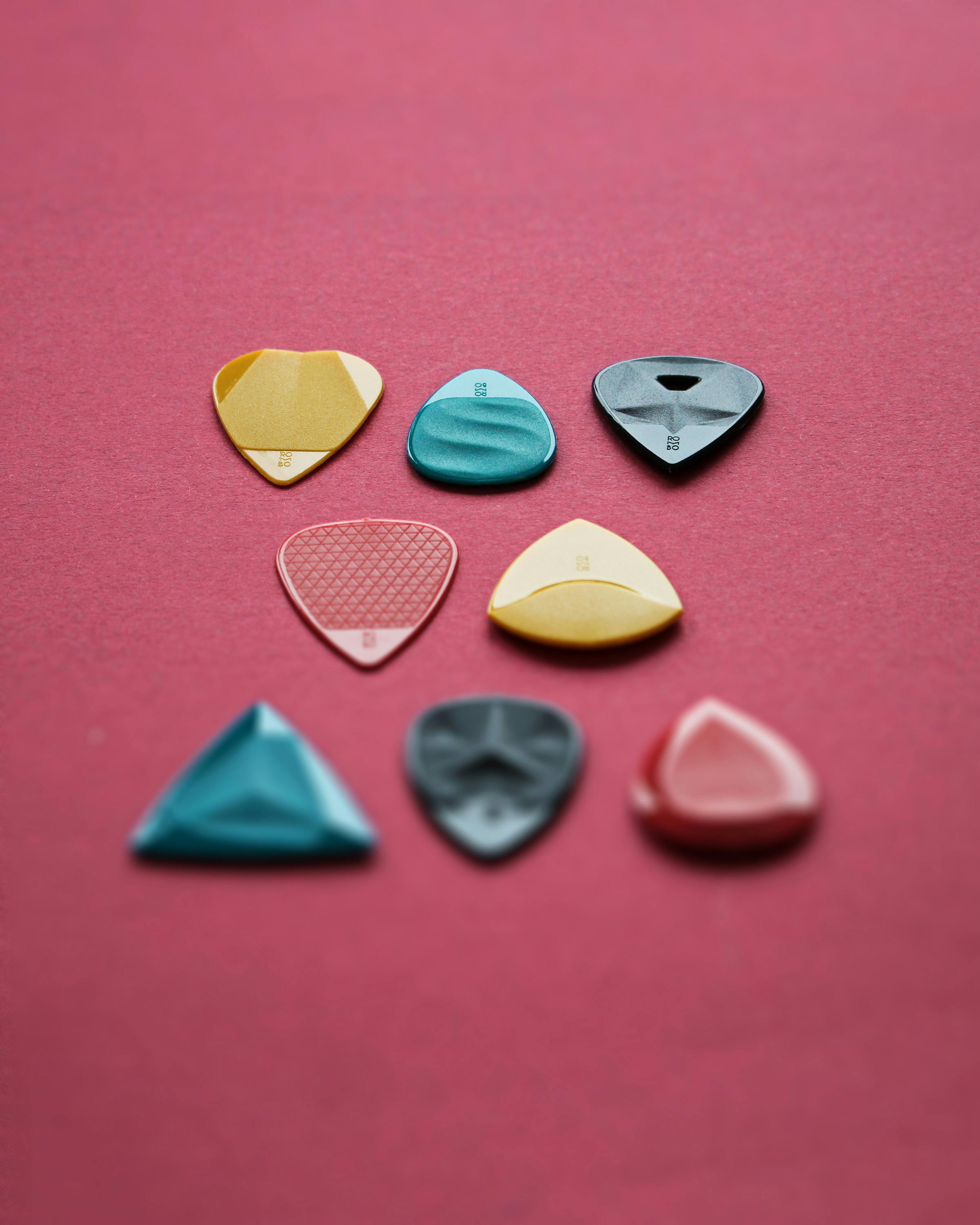 Shallow Focus Photo of Pink Guitar Pick · Free Stock Photo