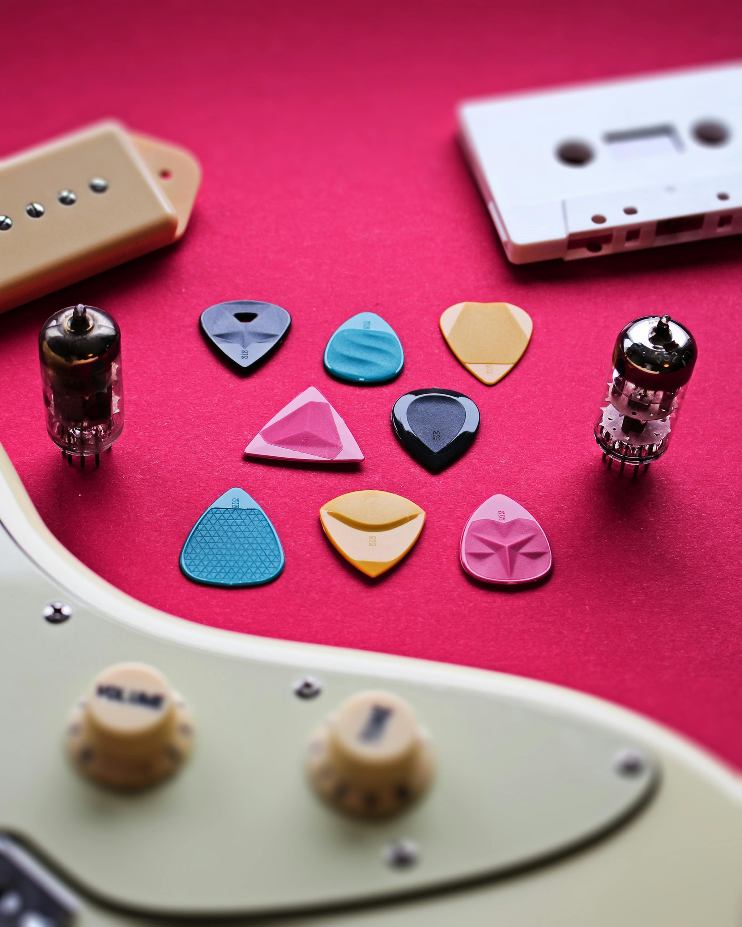 Shallow Focus Photo of Pink Guitar Pick · Free Stock Photo