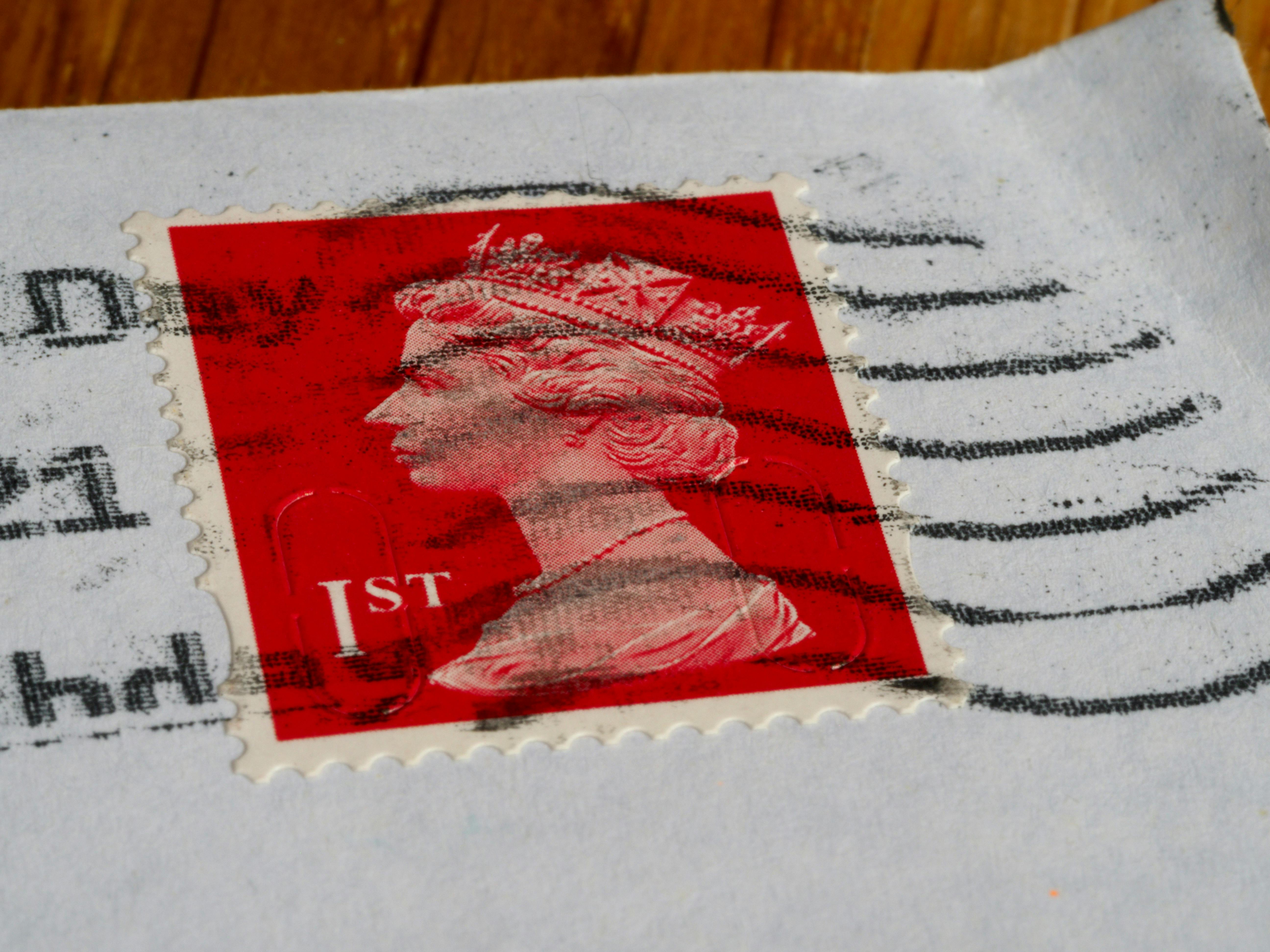 A Postage Stamp on a Hand · Free Stock Photo