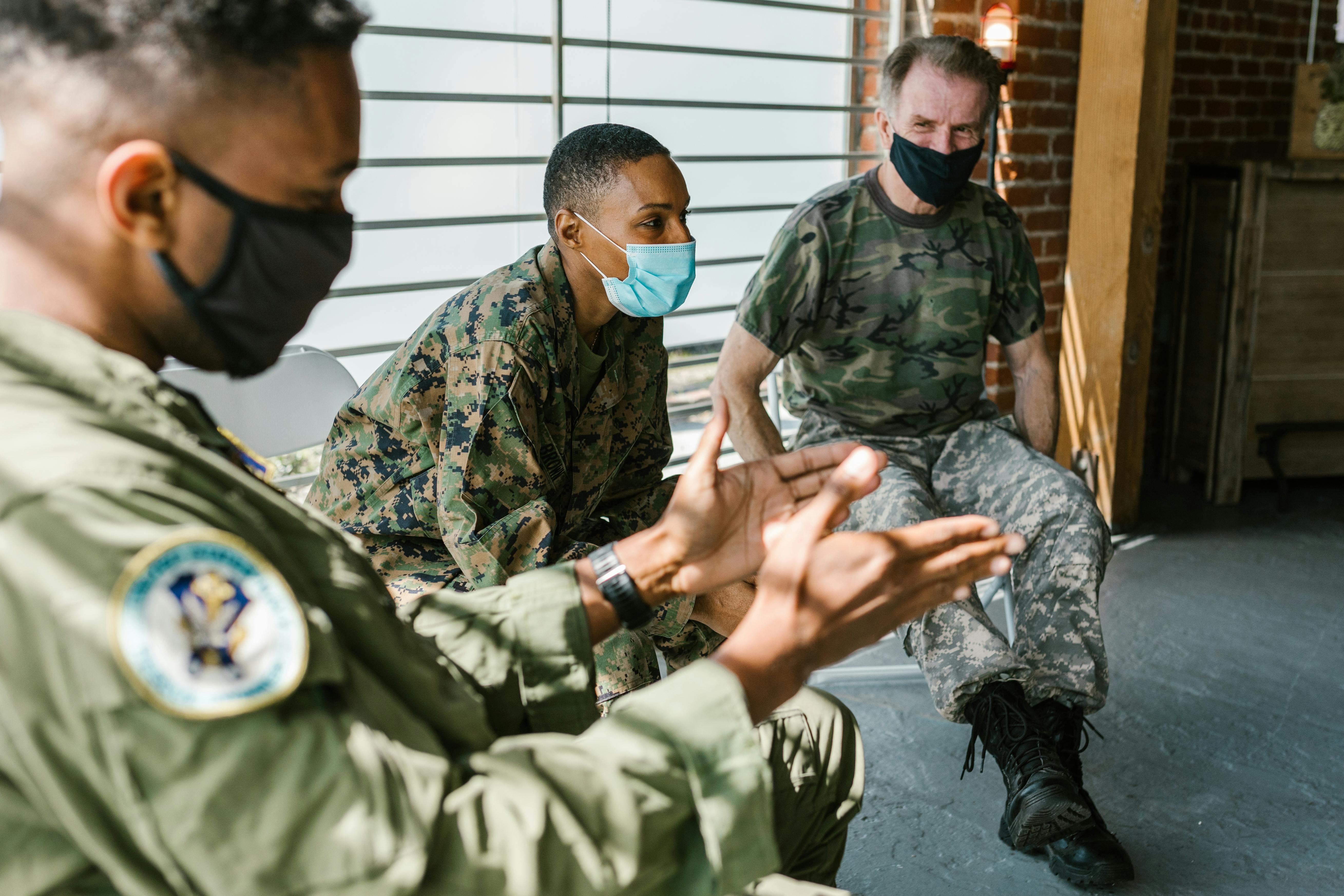 Photo of Soldiers Sitting on Folding Chairs · Free Stock Photo