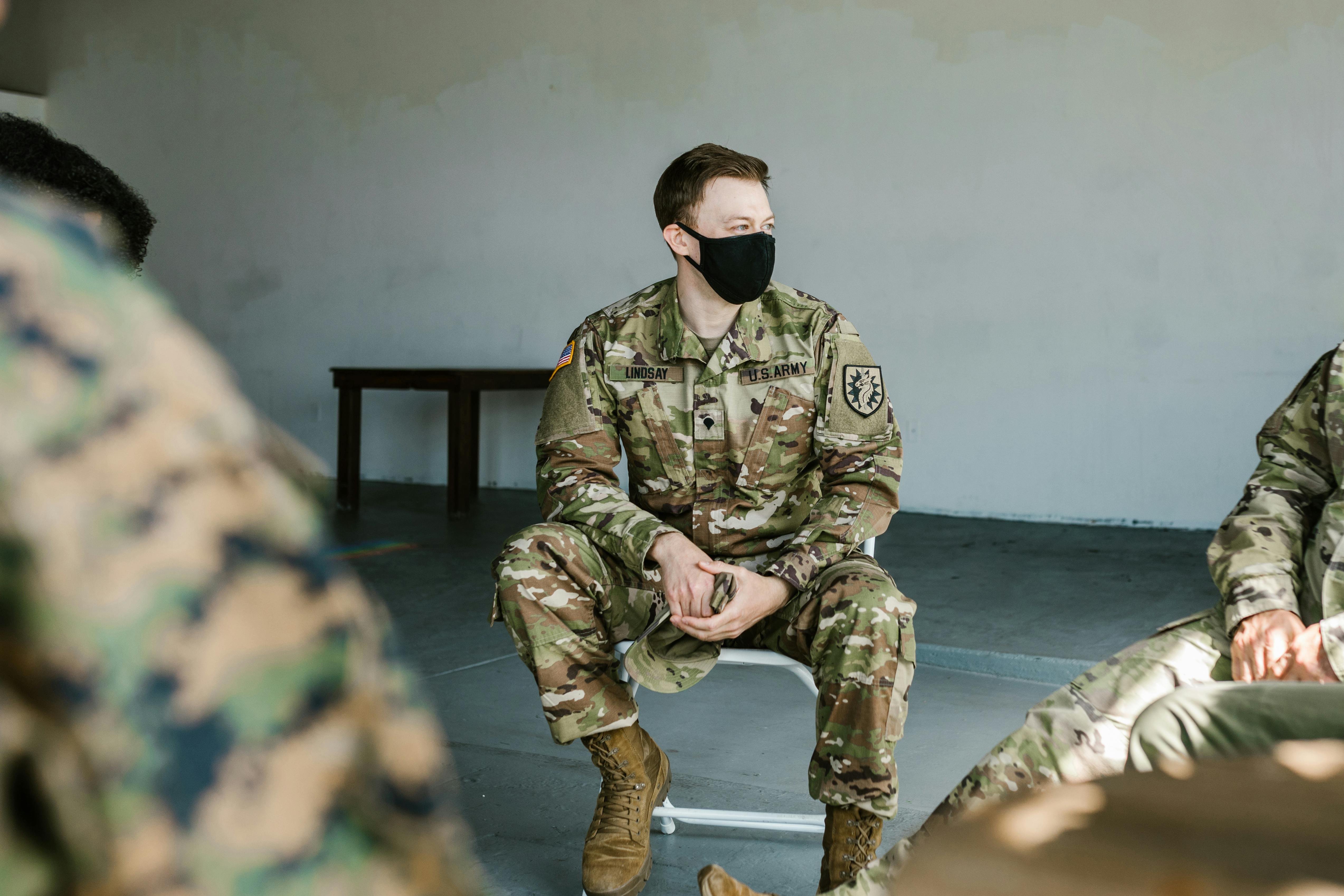 Photo of Soldiers Sitting on Folding Chairs · Free Stock Photo