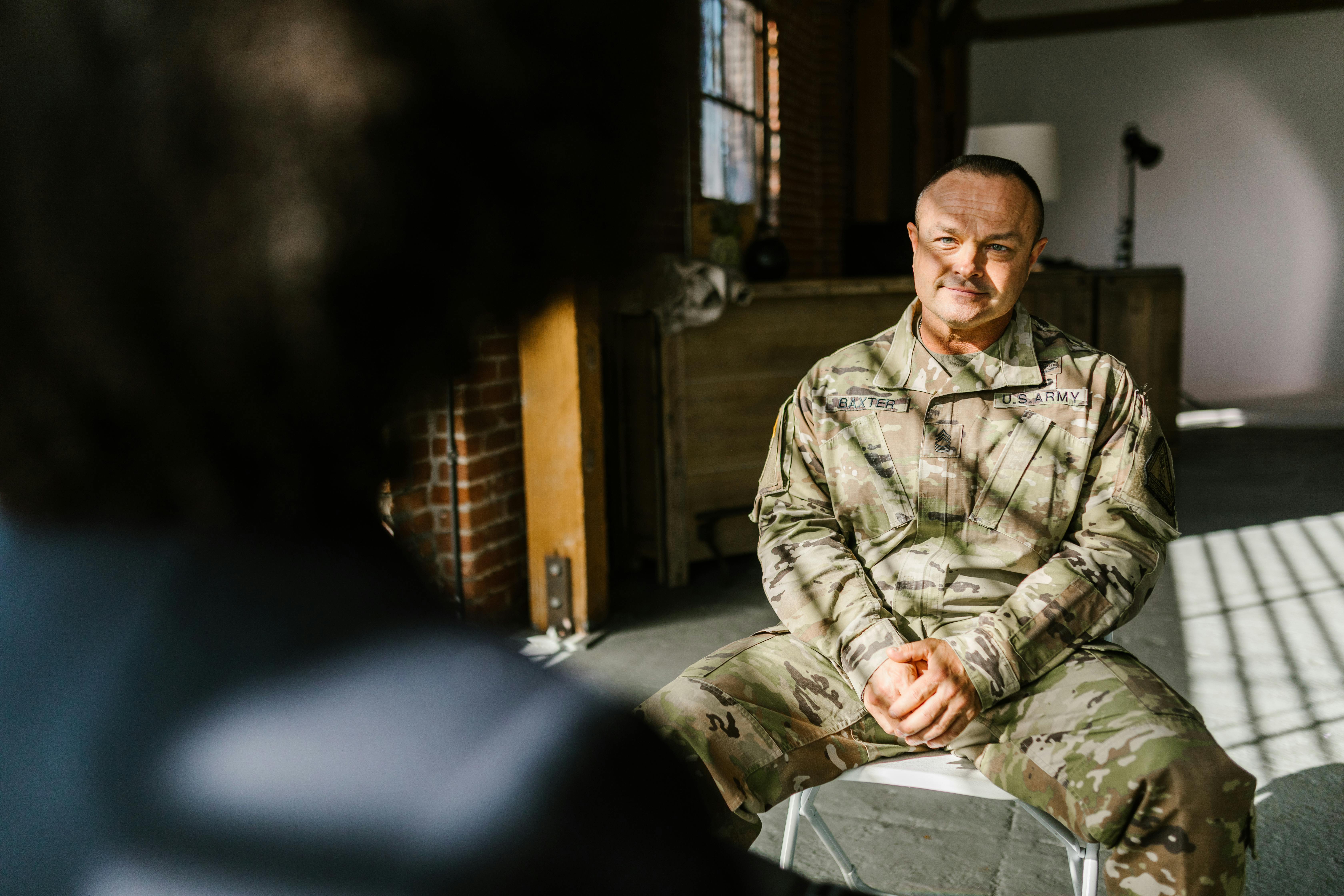 Photo of Psychologist Listening to a Soldier · Free Stock Photo