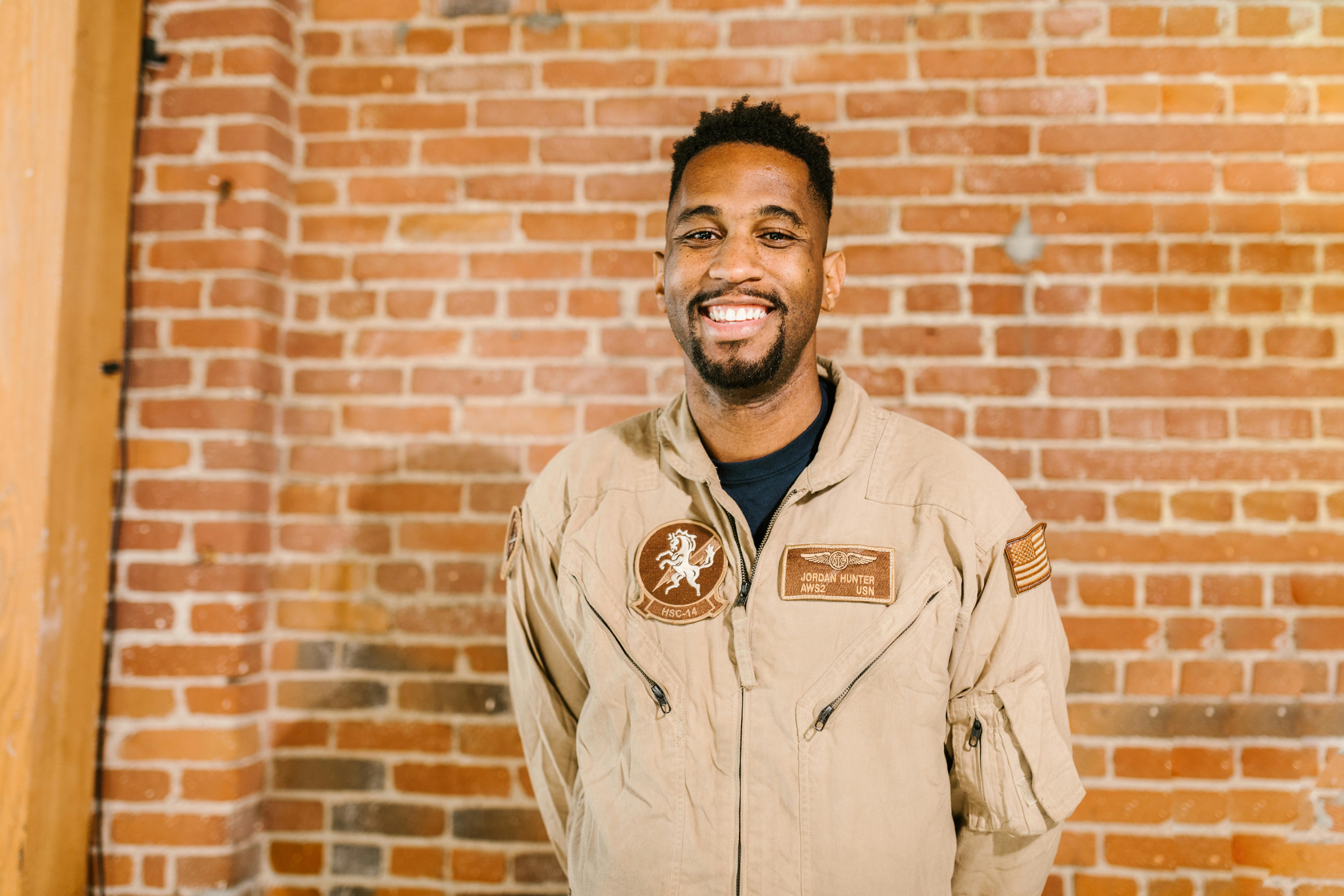 Photo of a Happy Man in Military Uniform · Free Stock Photo