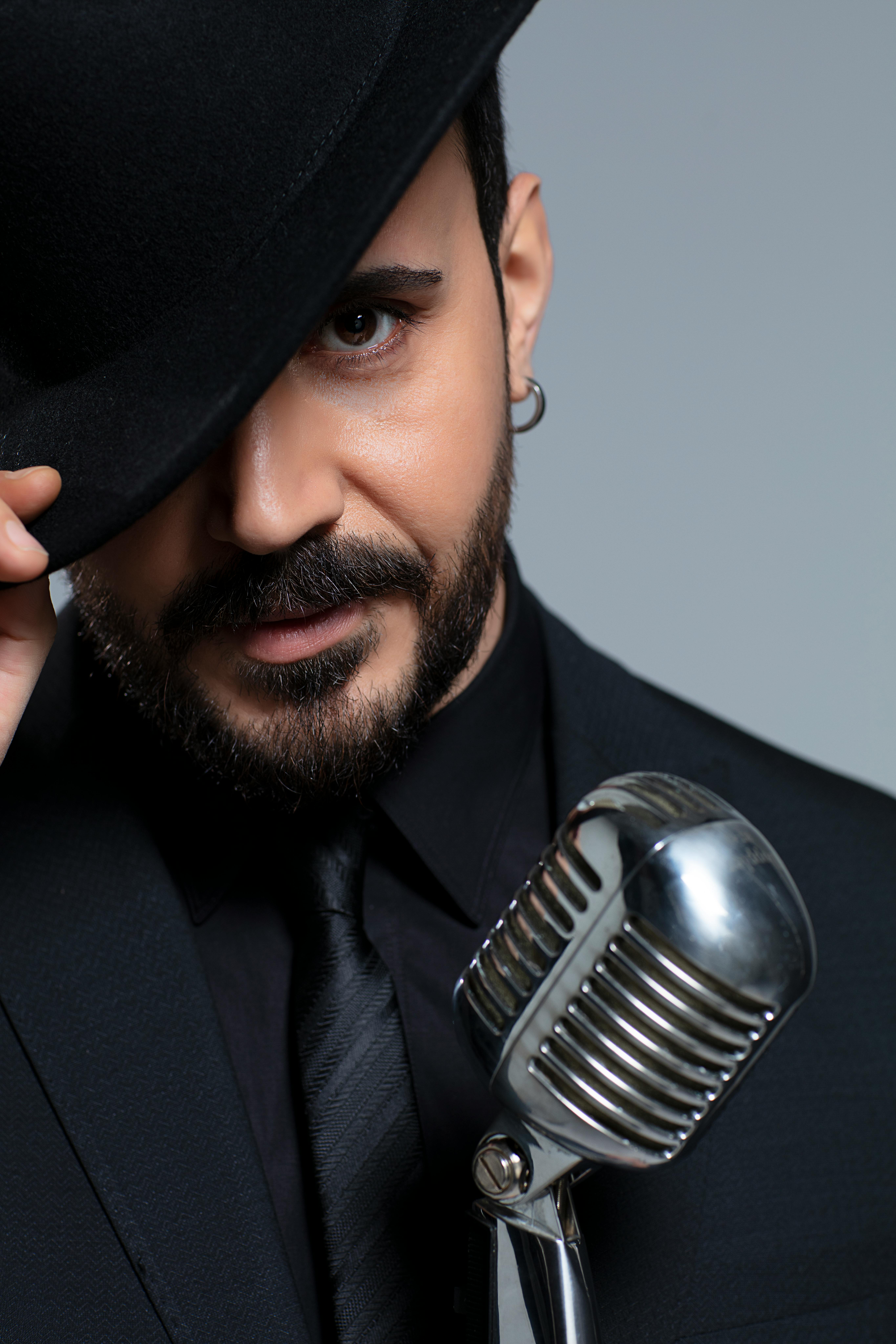 A Singer Wearing a Hat · Free Stock Photo