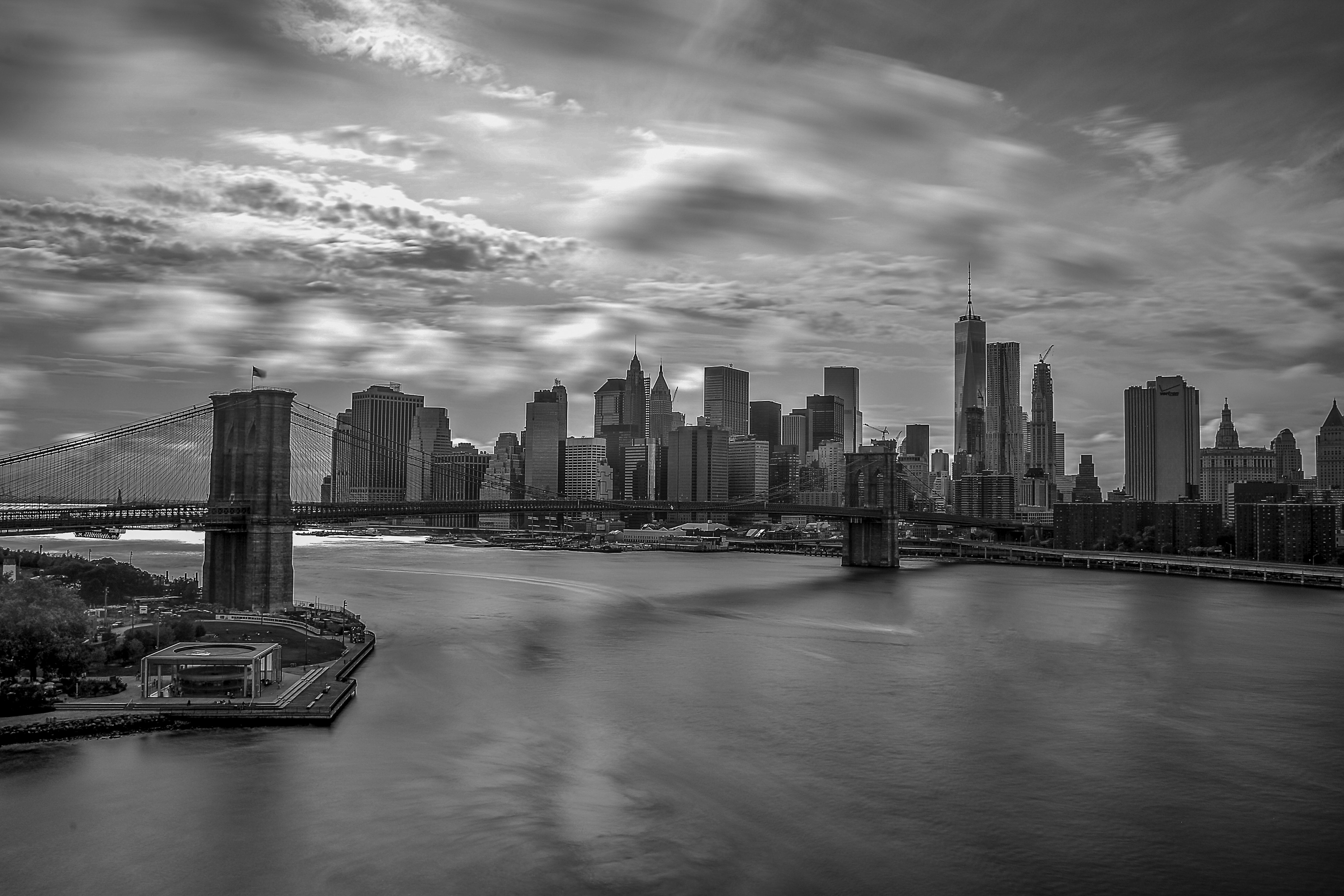 Grayscale Photography of City Buildings and Bridge · Free Stock Photo