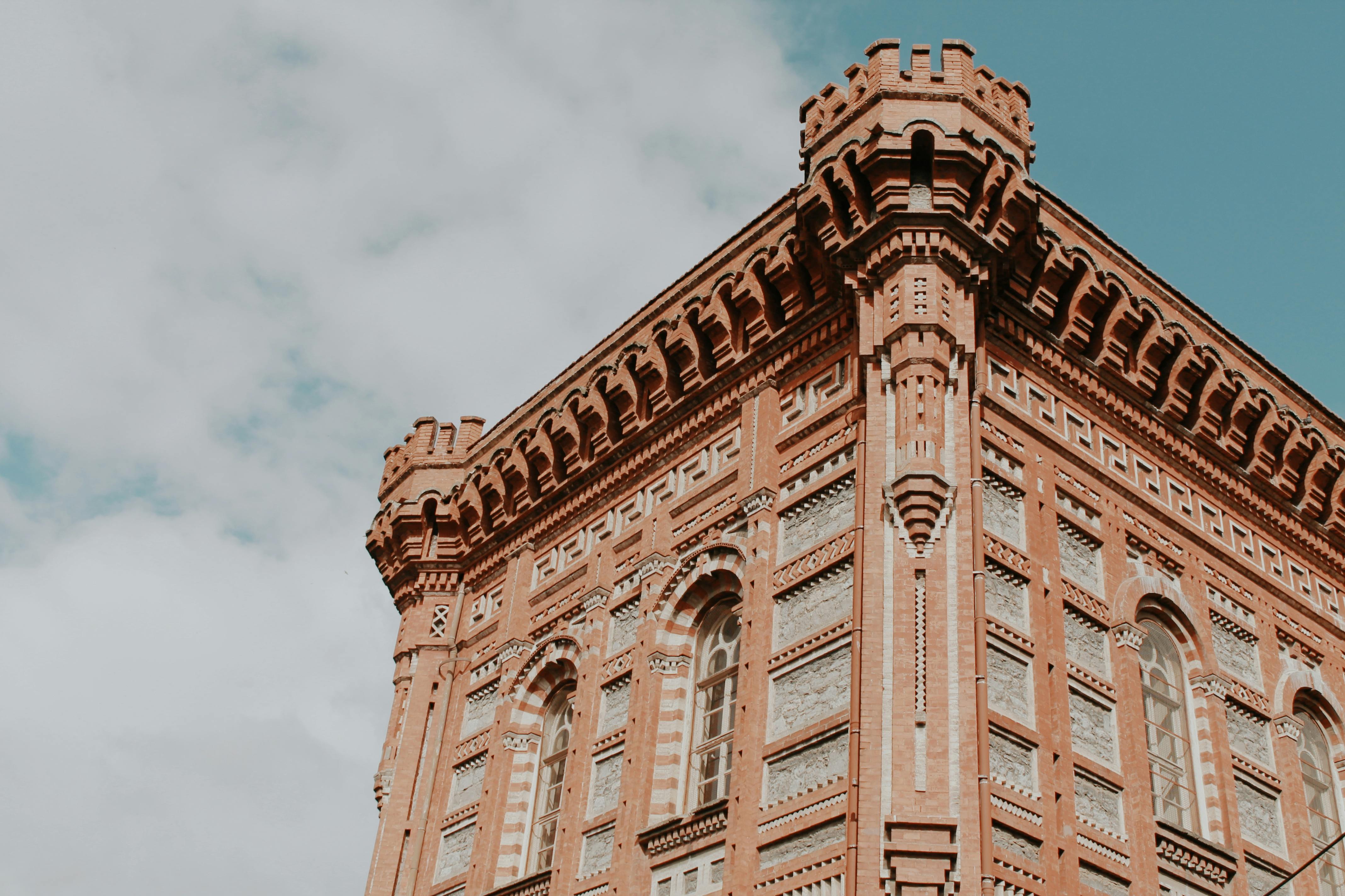 Red Brick Historical Building with Decorative Relief · Free Stock Photo