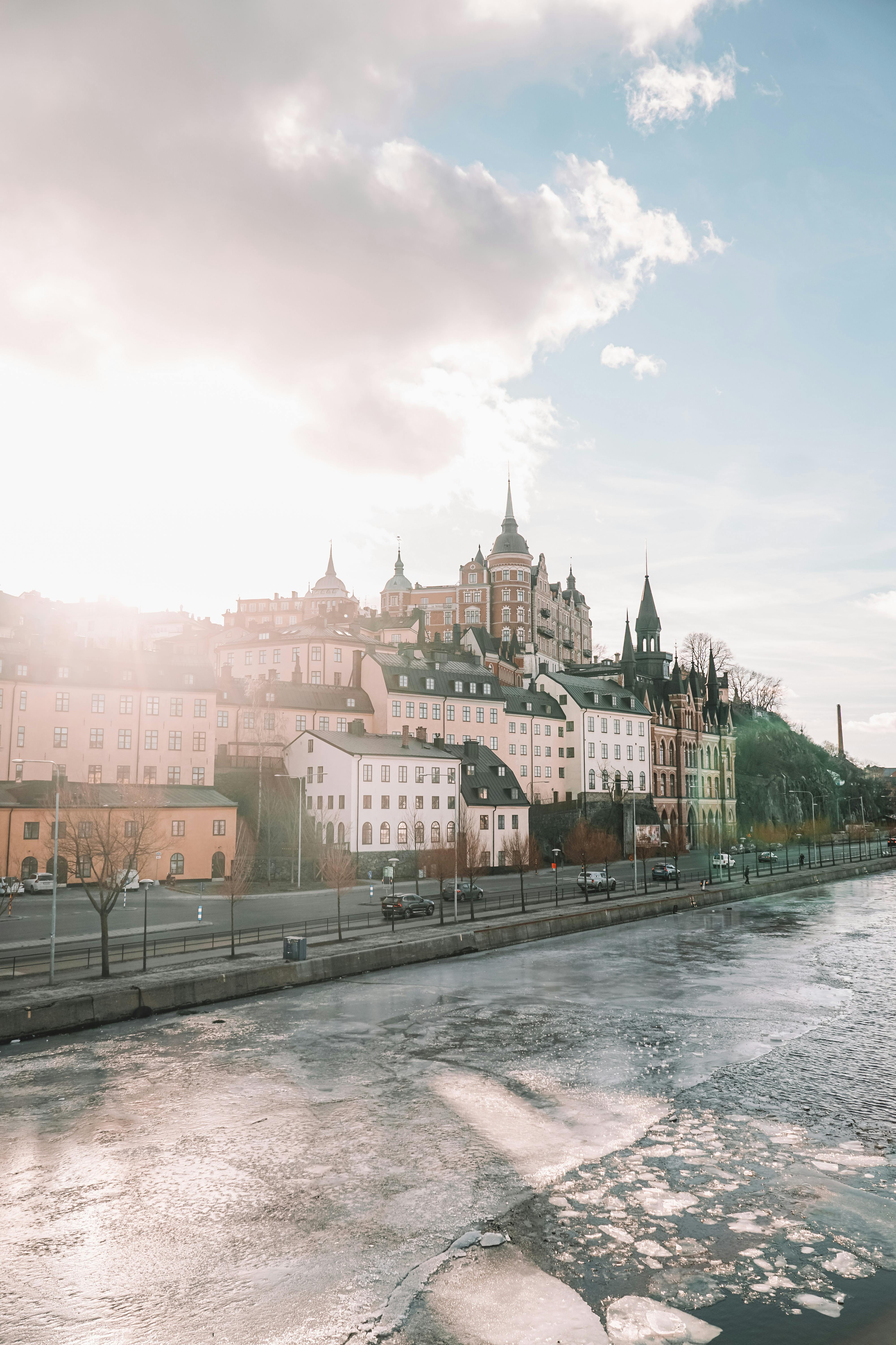 Ancient City Buildings near Frozen River · Free Stock Photo