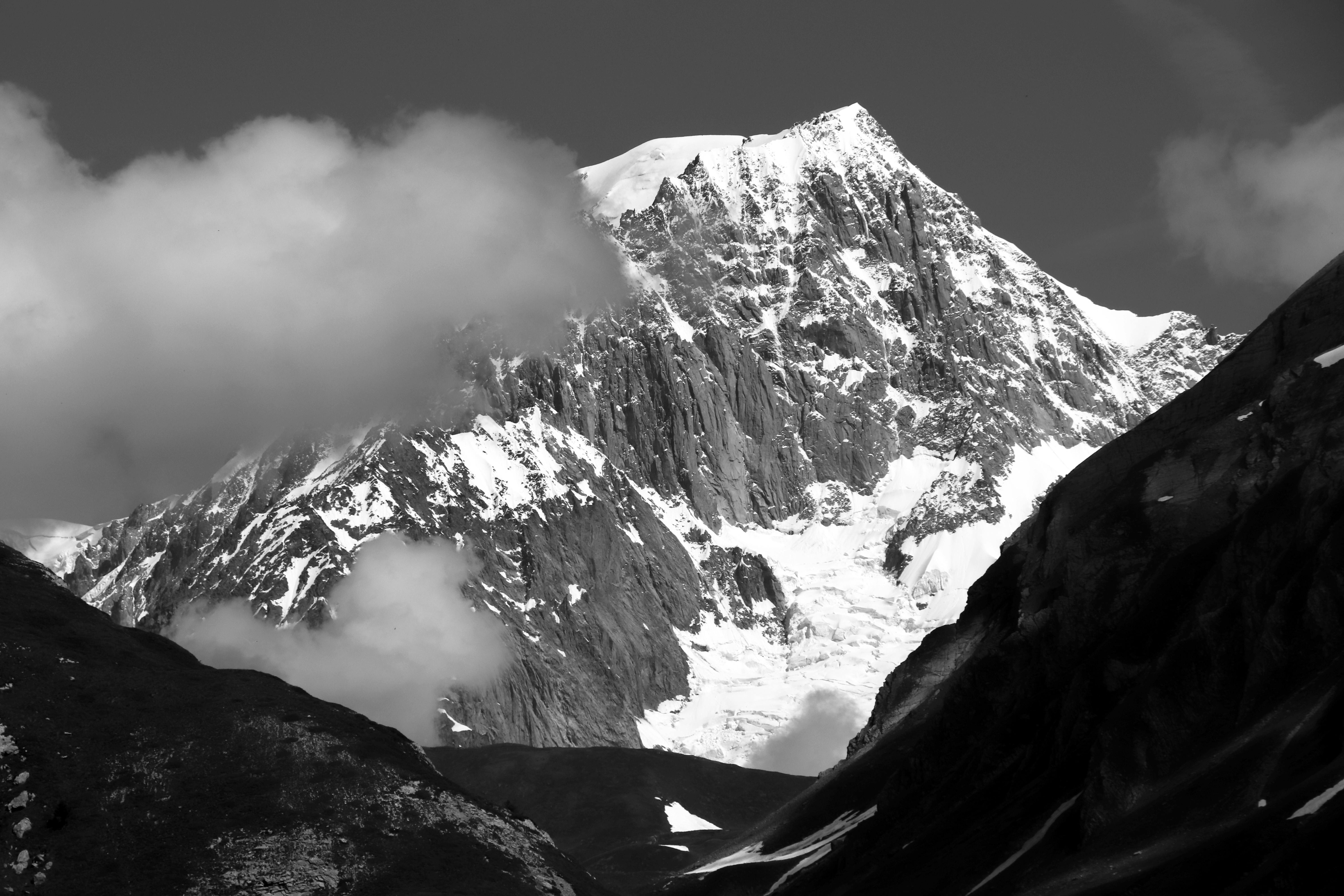 Grayscale Photo of Snow-Covered Mountains · Free Stock Photo