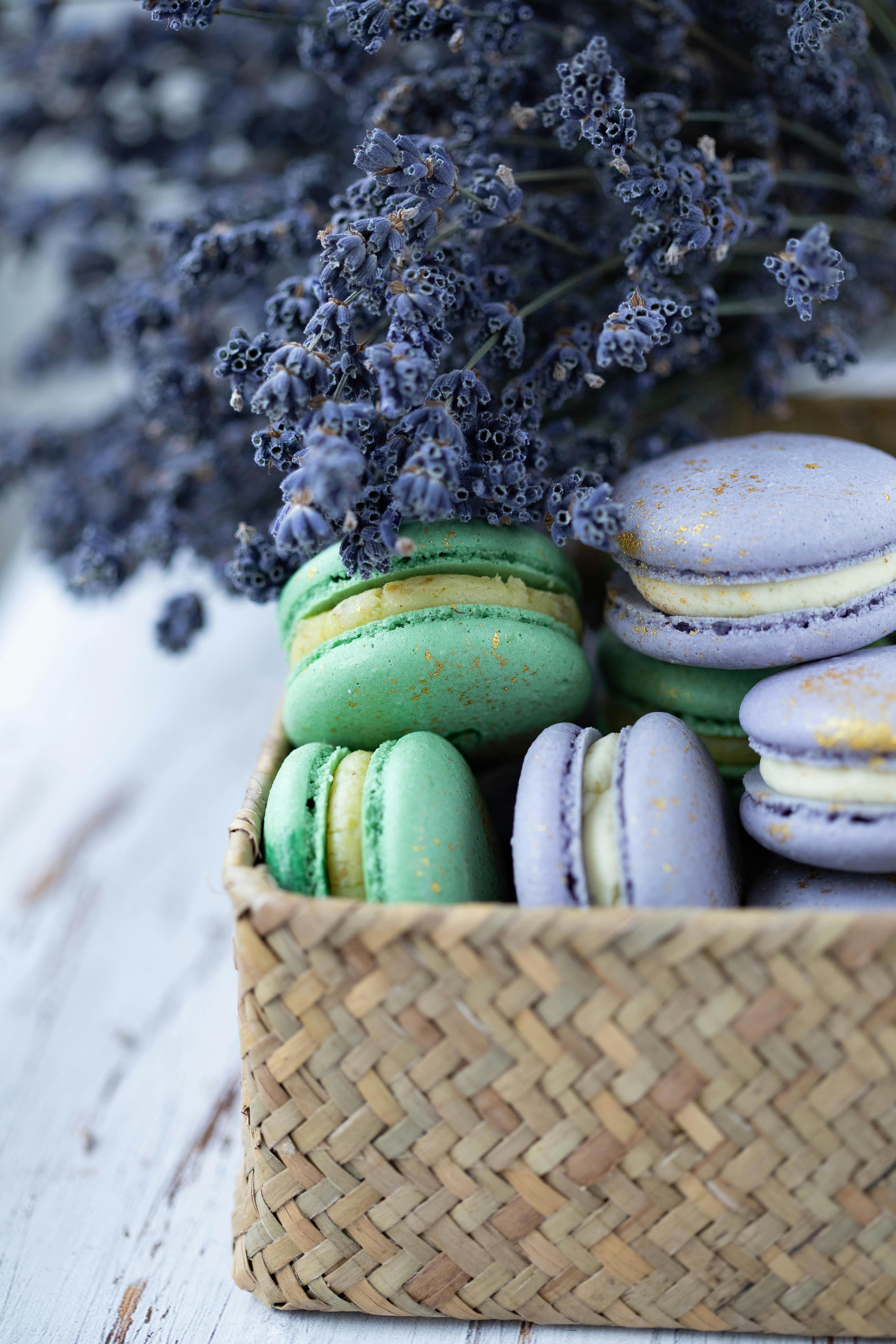 Purple macaroons covered with golden shimmer under blooming lavender ...
