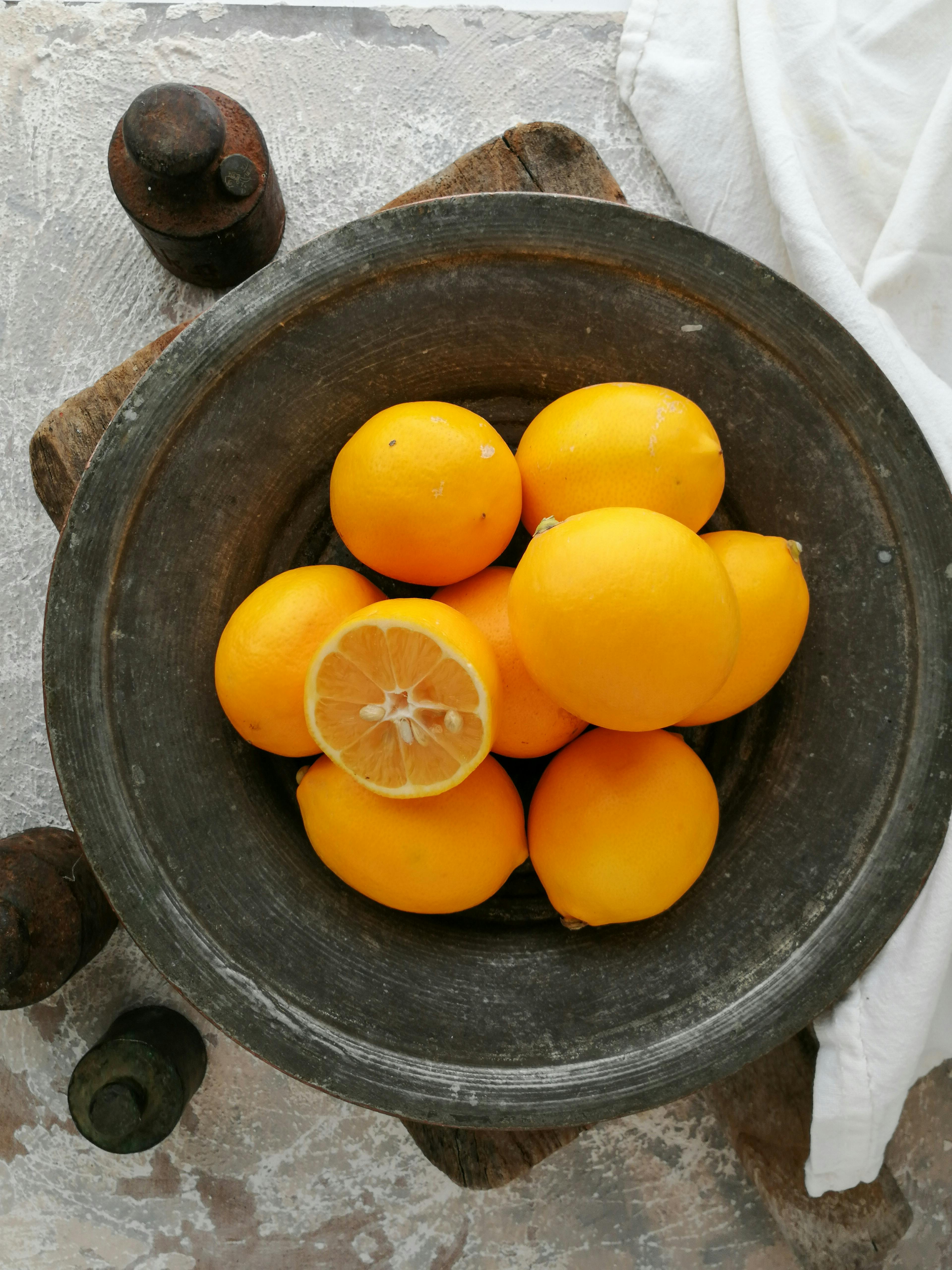 Yellow Citrus Fruits in Black Round Container · Free Stock Photo
