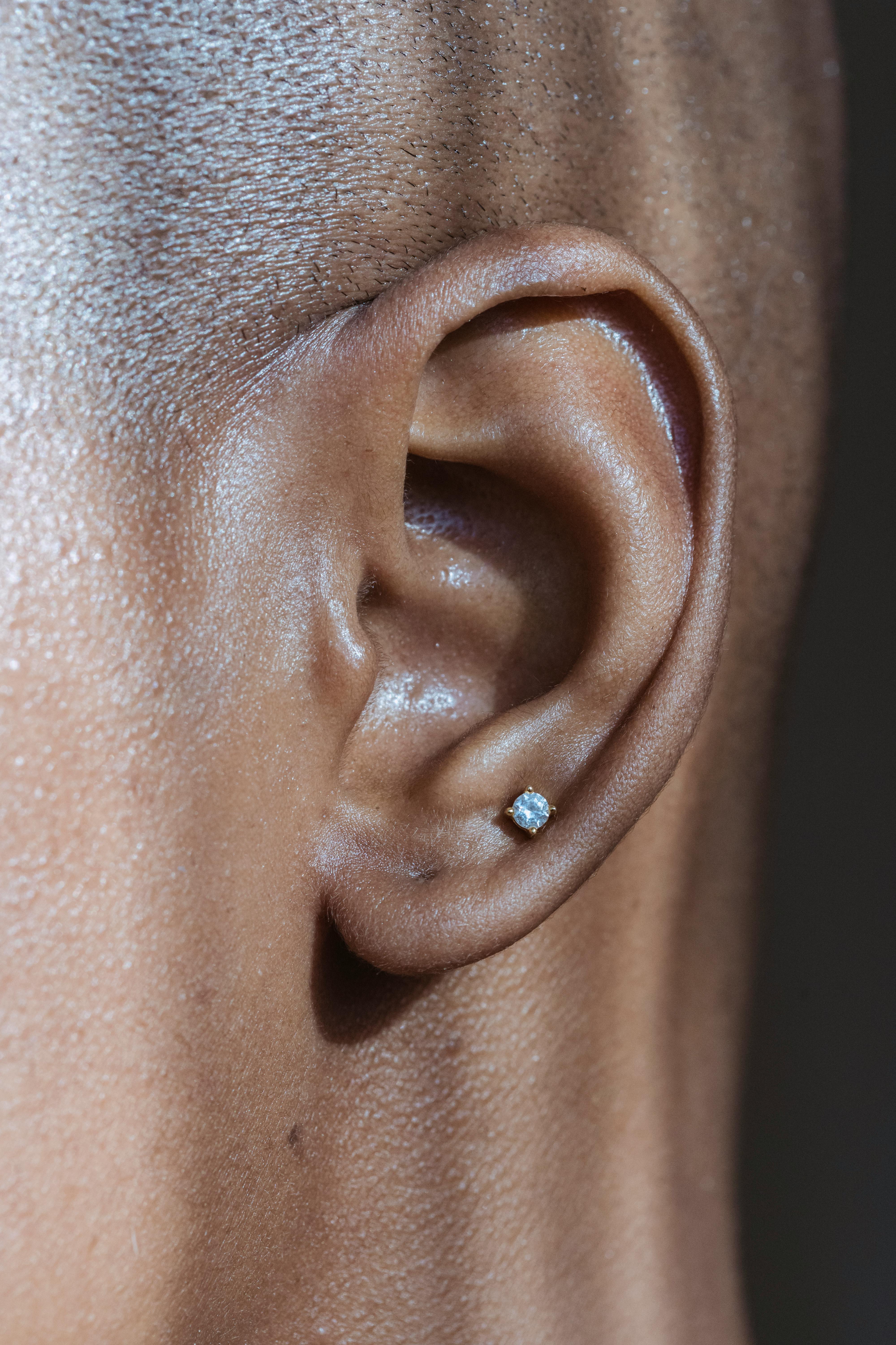 Close-Up Photo of a Person's Ear · Free Stock Photo