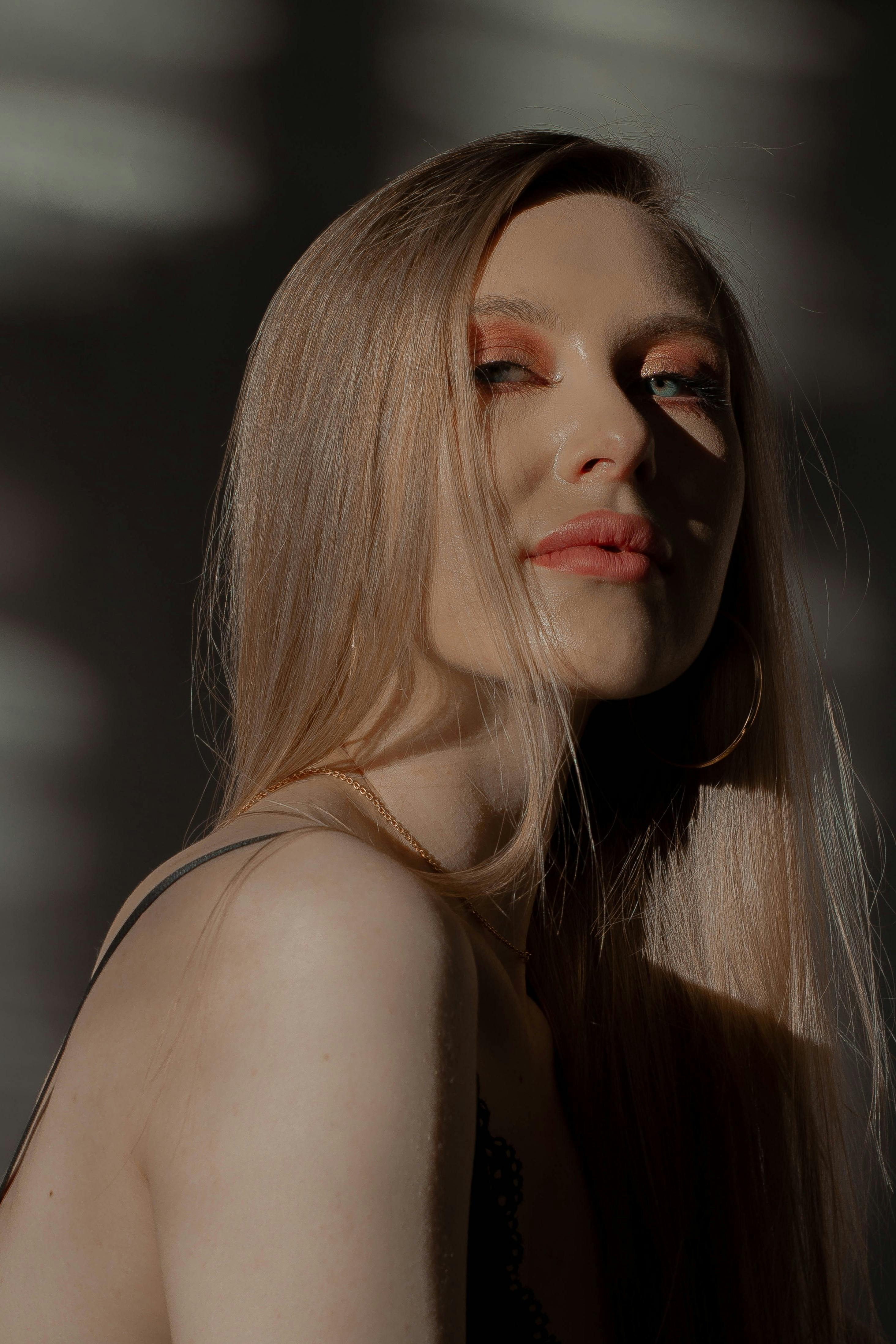 Millennial model with blue eyes and shade on face · Free Stock Photo