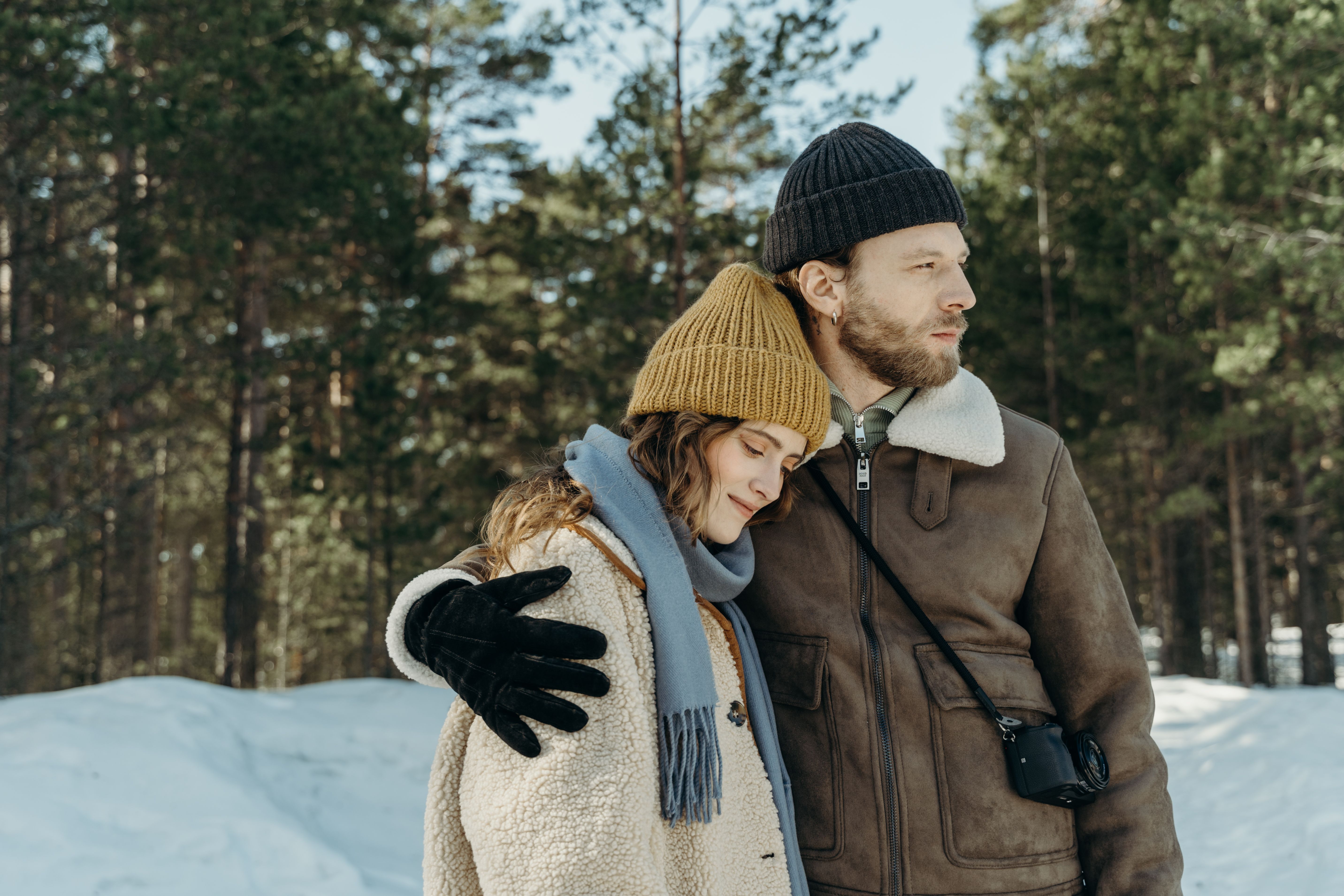 Man in Brown Jacket Hugging Woman in Beige Coat · Free Stock Photo
