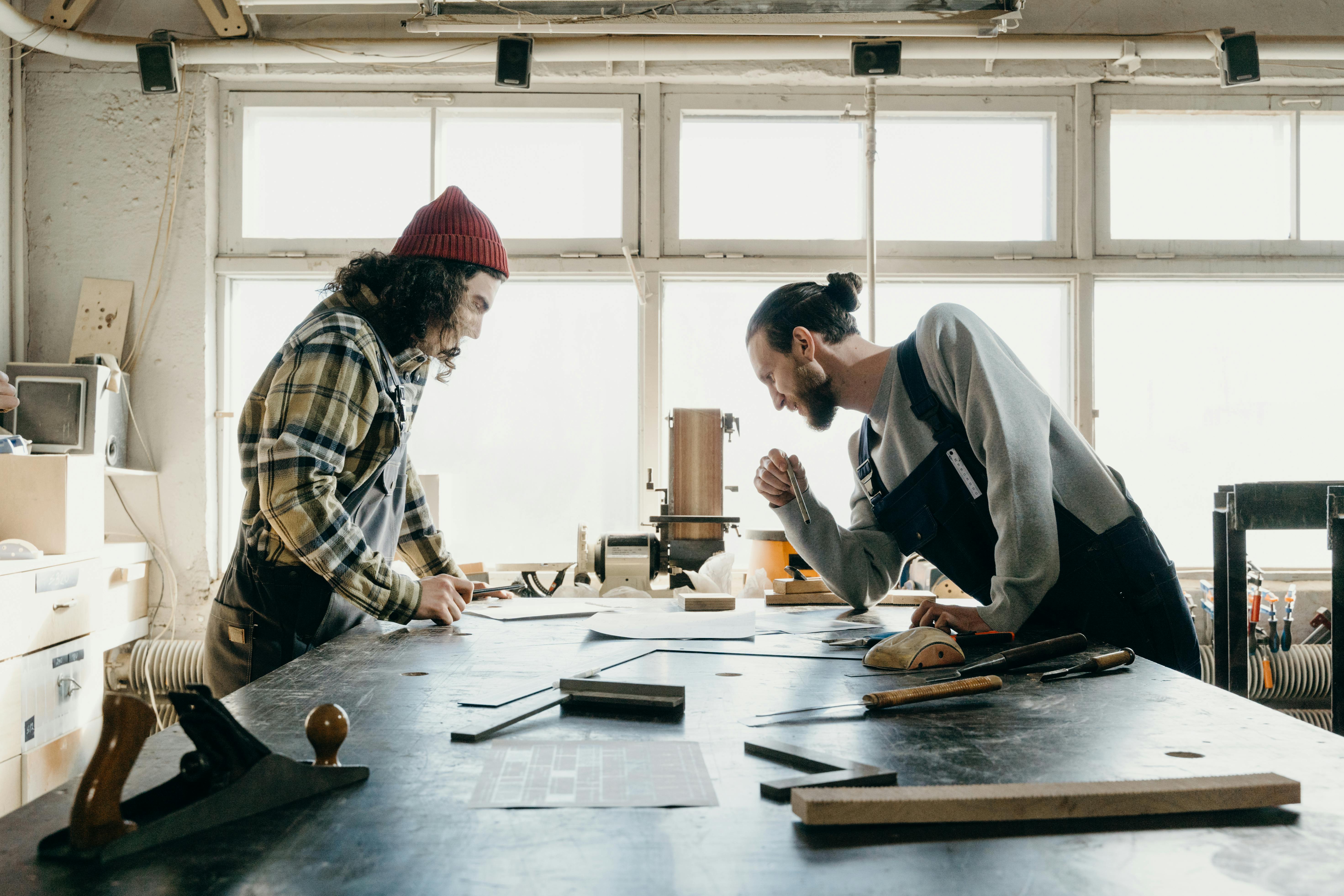 Men Working at a Table · Free Stock Photo