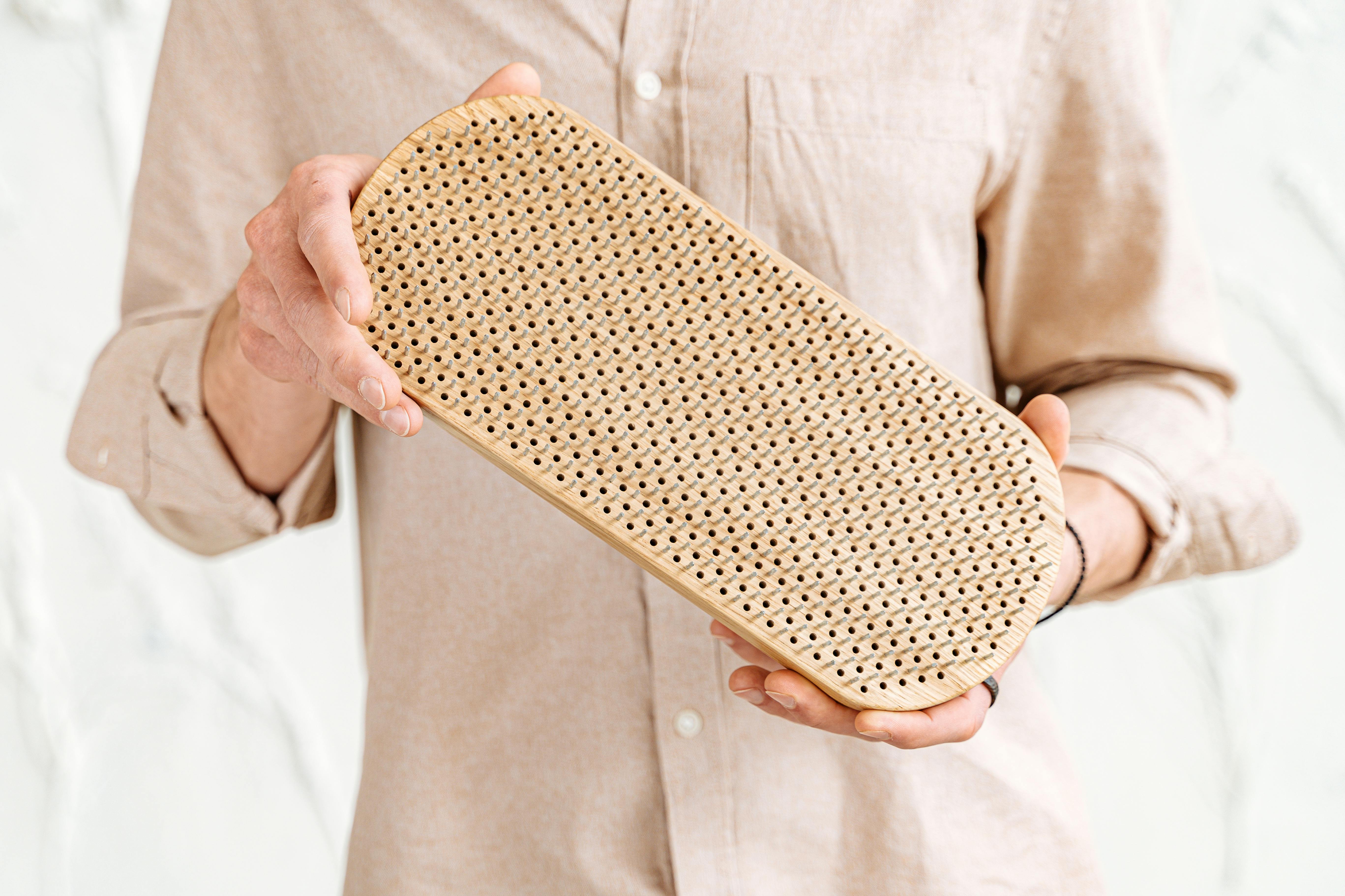 A Person Holding an Sadhu Board · Free Stock Photo