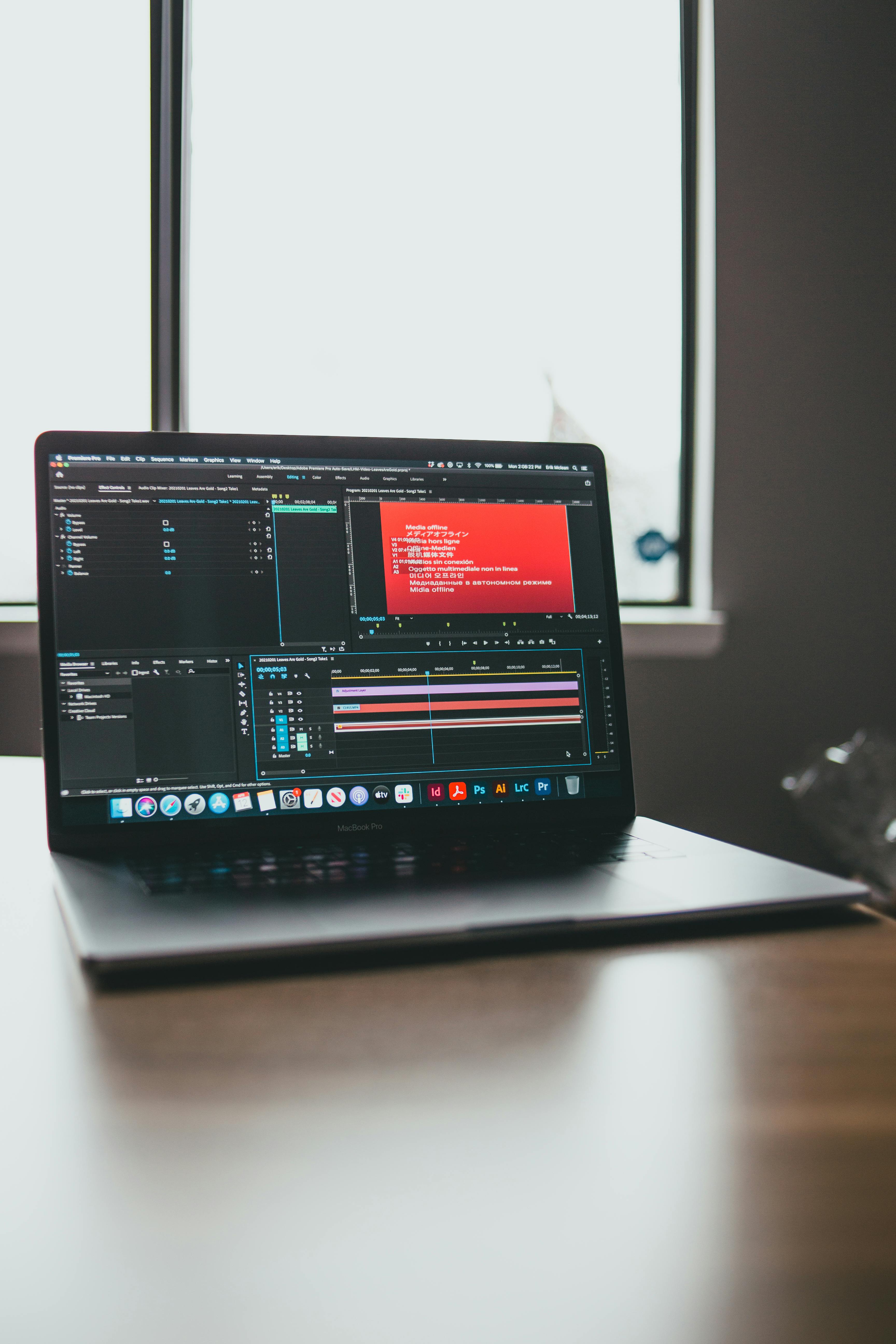 Open laptop placed on gray sofa · Free Stock Photo