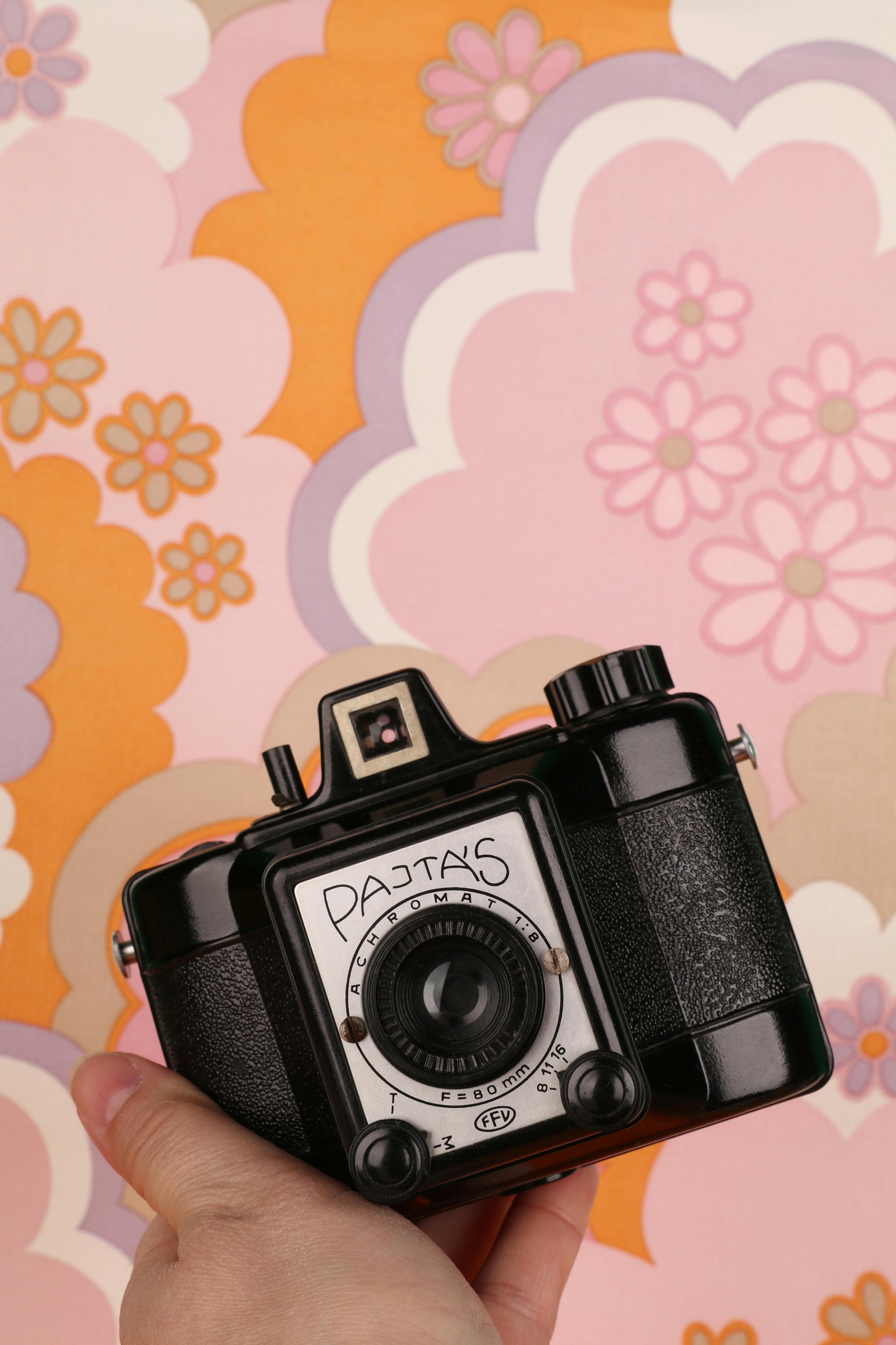 Instamatic Camera in Hand · Free Stock Photo