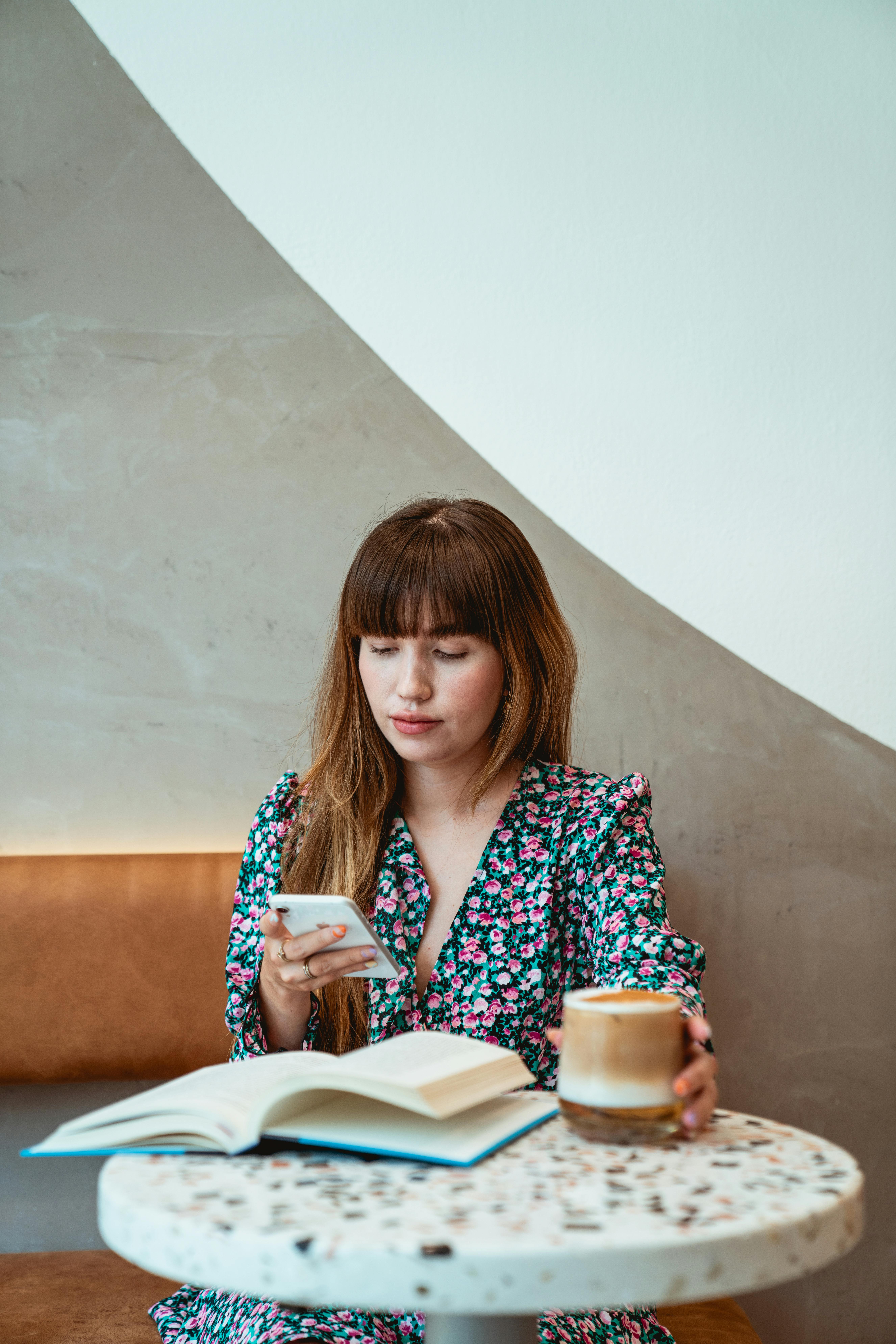 A Woman Sitting at the Table · Free Stock Photo