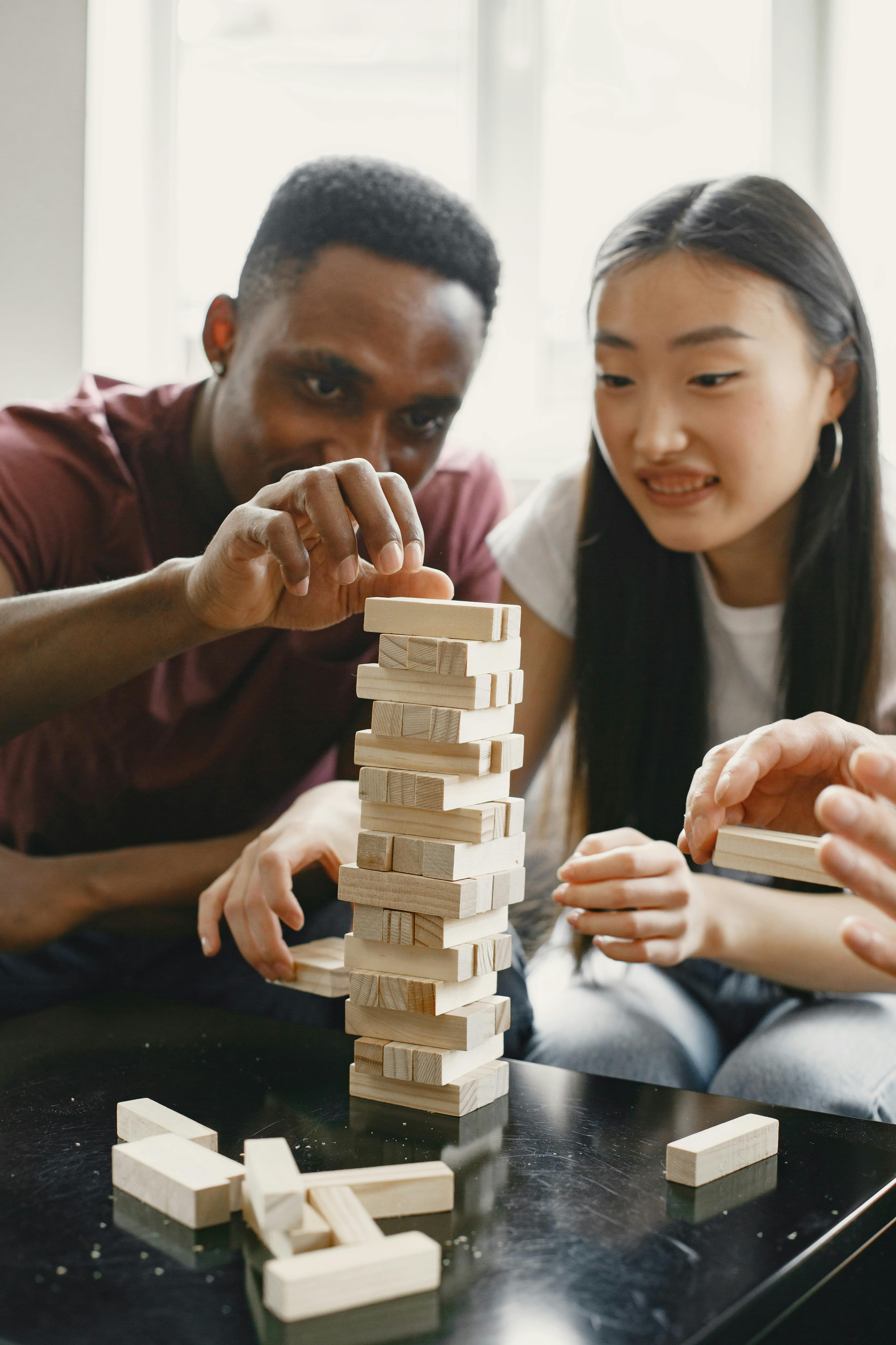Man and Woman Playing Jenga · Free Stock Photo