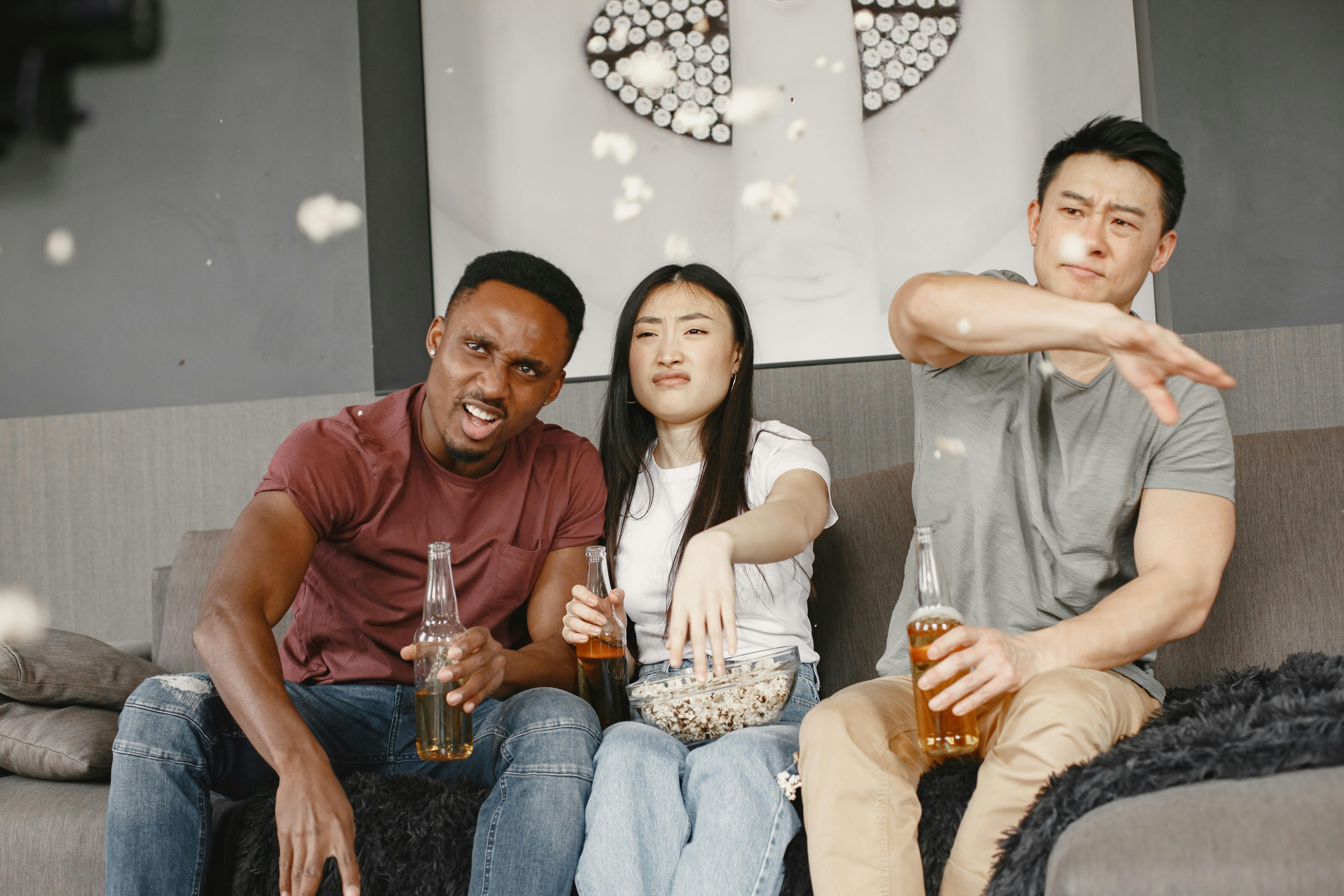 Friends Throwing Popcorn · Free Stock Photo