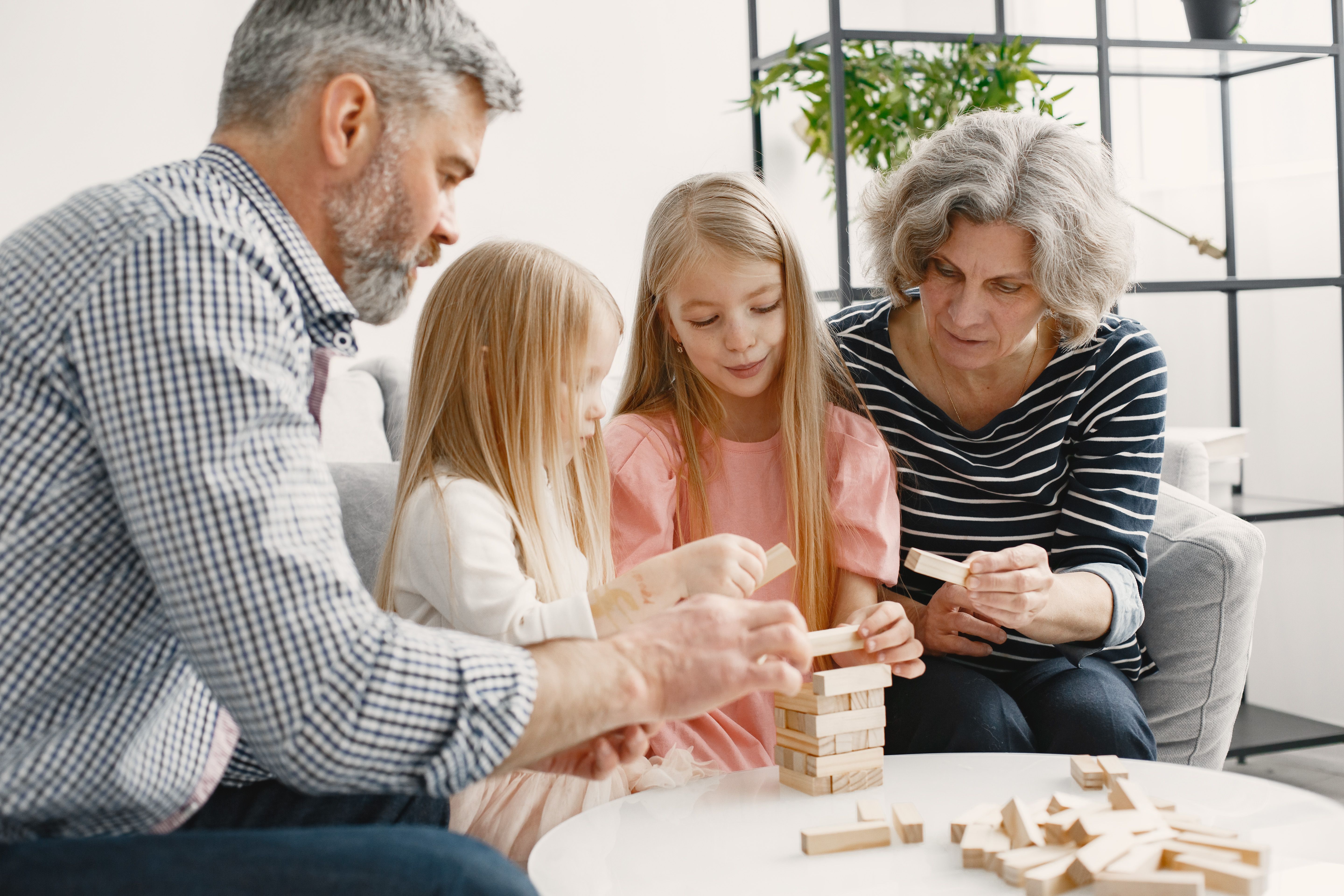 A Family Playin at the Table · Free Stock Photo