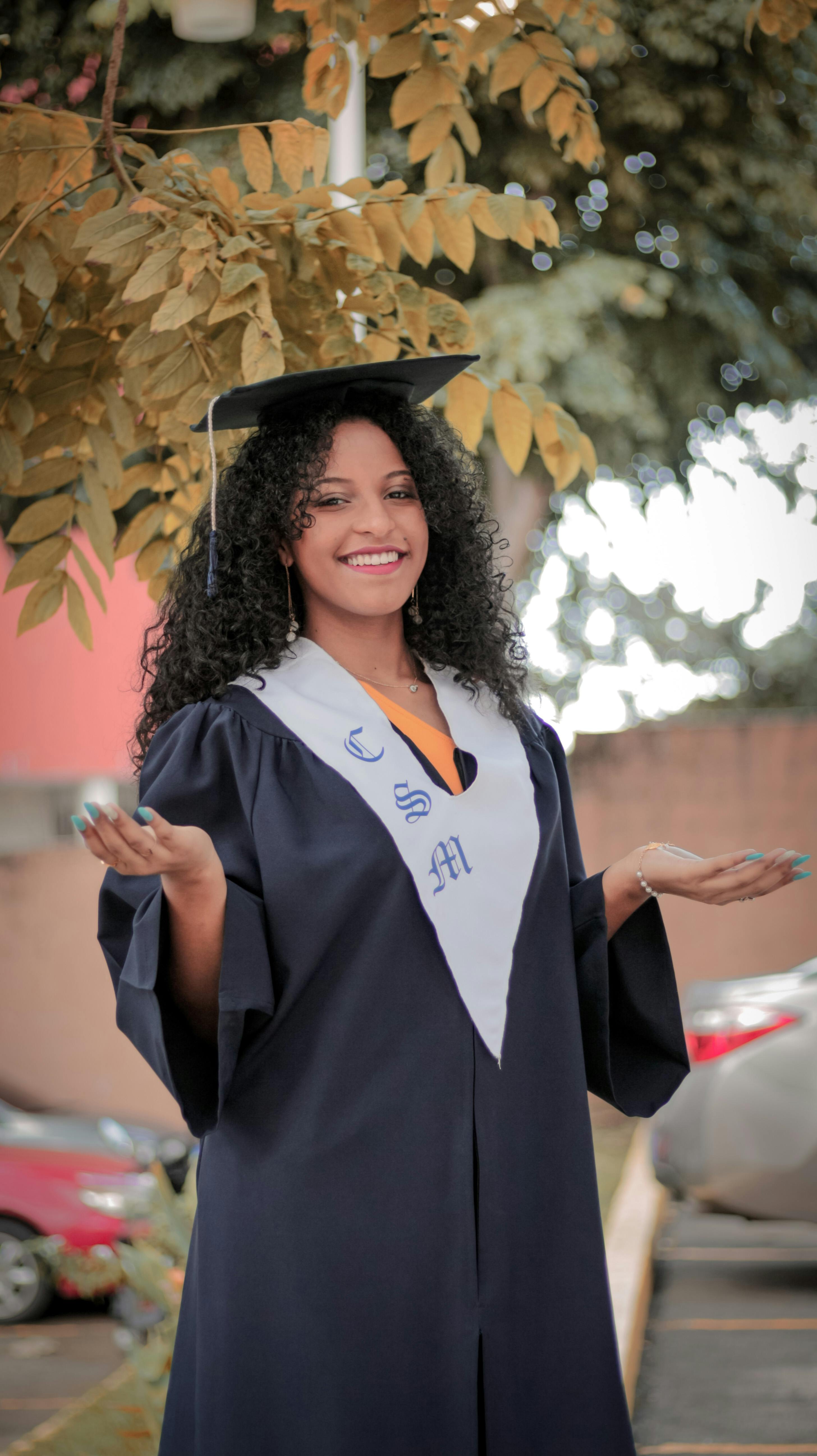 A Girl Wearing a Graduation Gown · Free Stock Photo