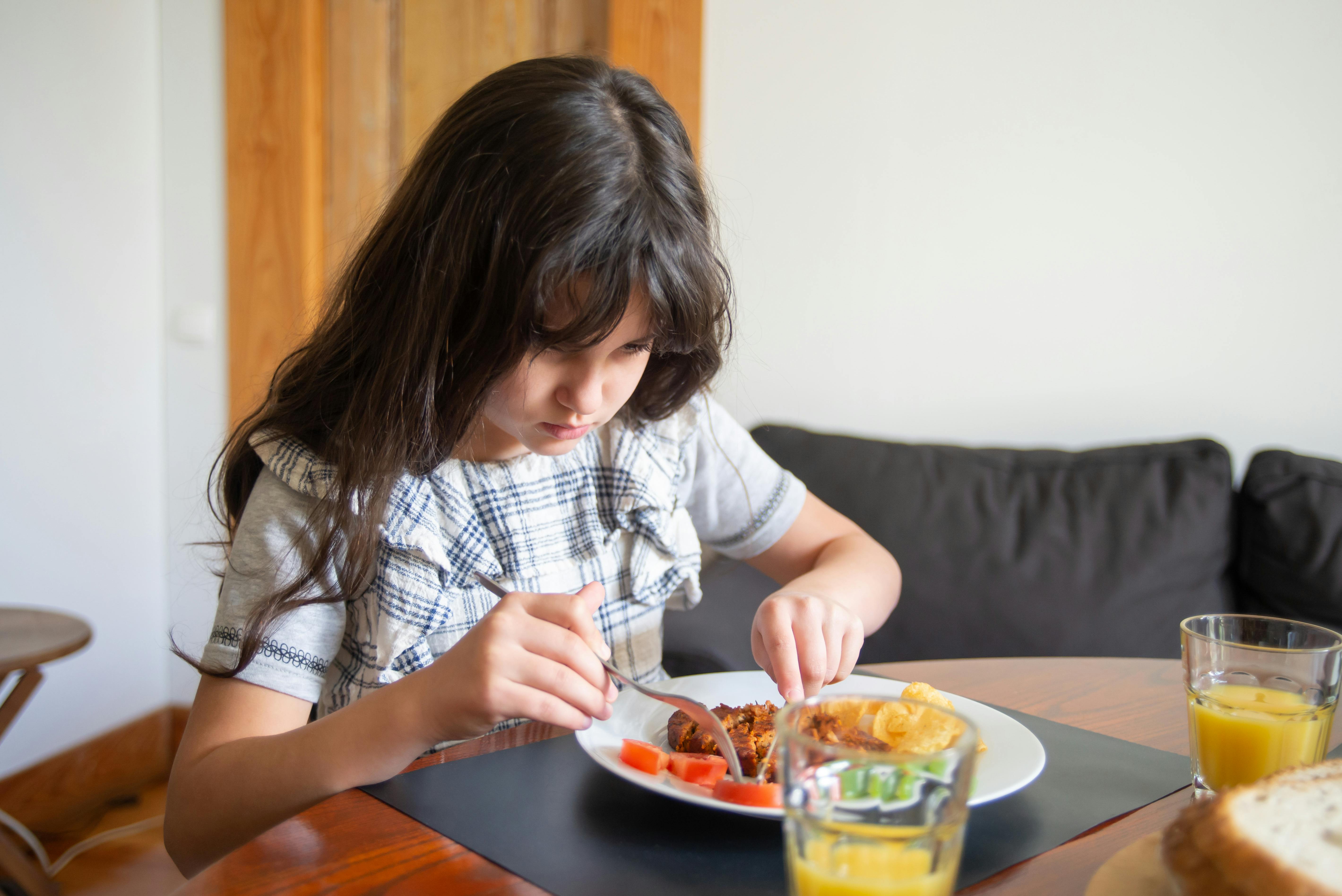 Close-up Photo of Girl eating her Breakfast · Free Stock Photo