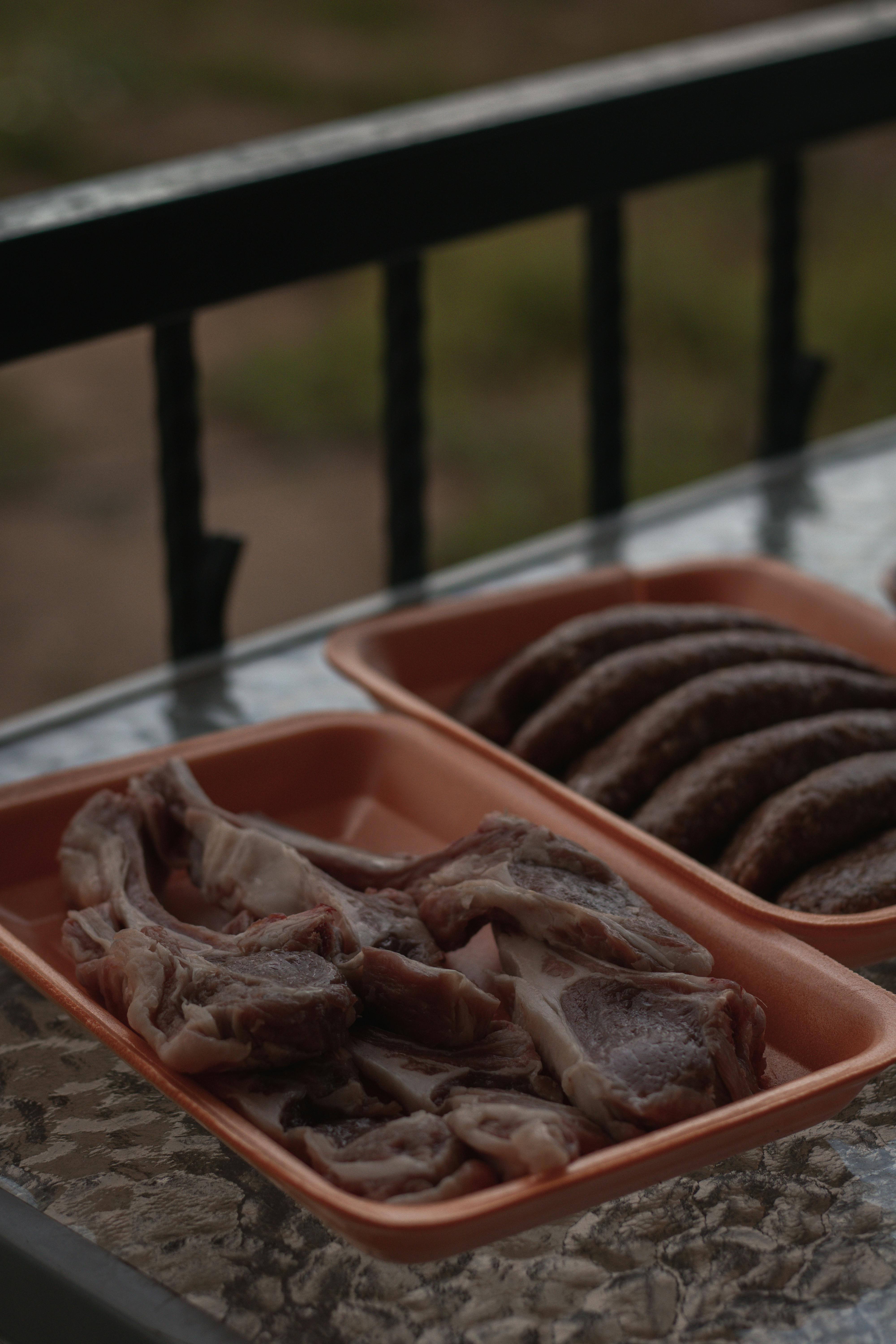 Close-Up Shot of Slices of Raw Meat on Plastic Containers · Free Stock ...
