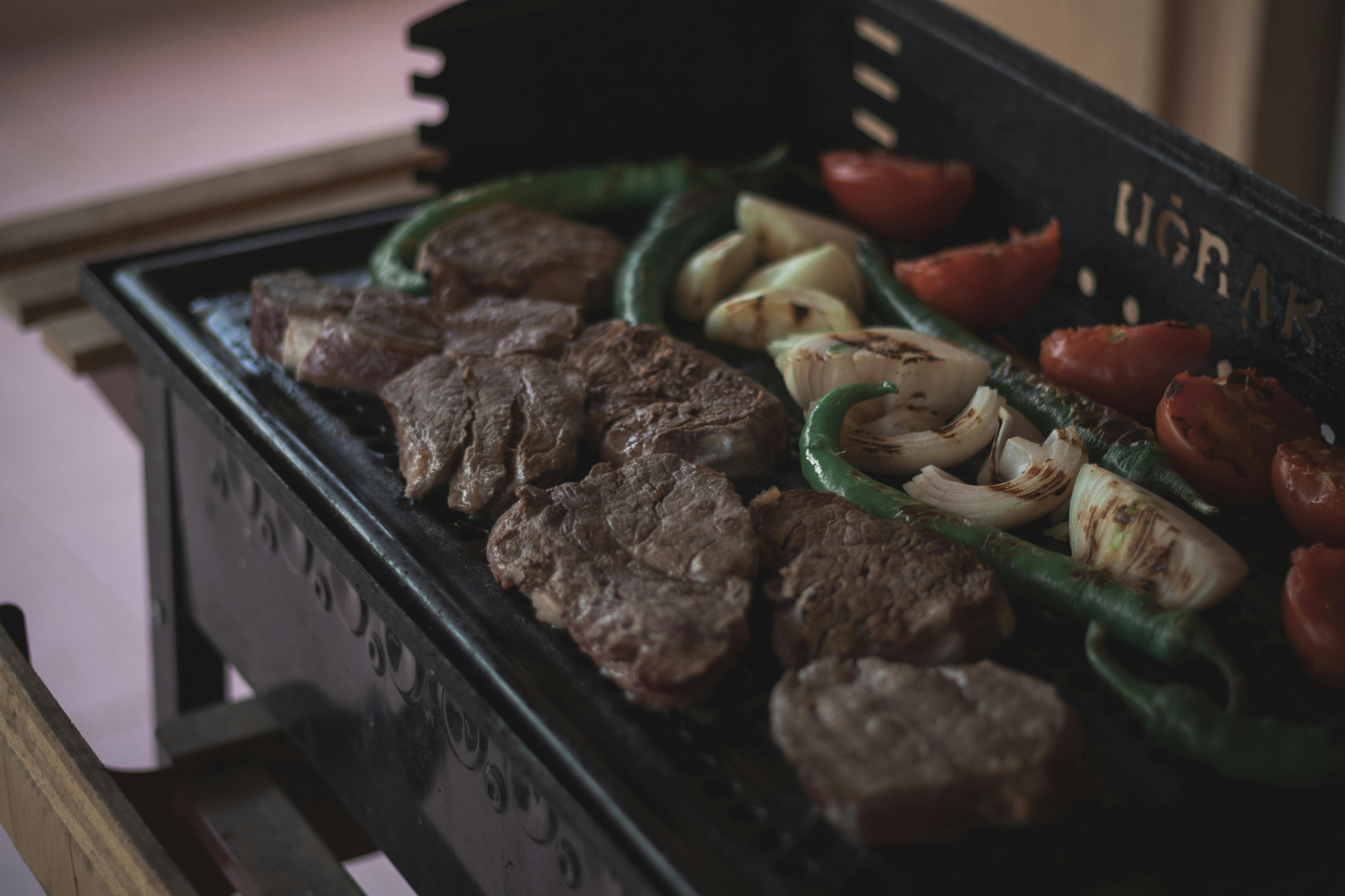 Close-Up Shot of Meat on a Barbecue Grill · Free Stock Photo