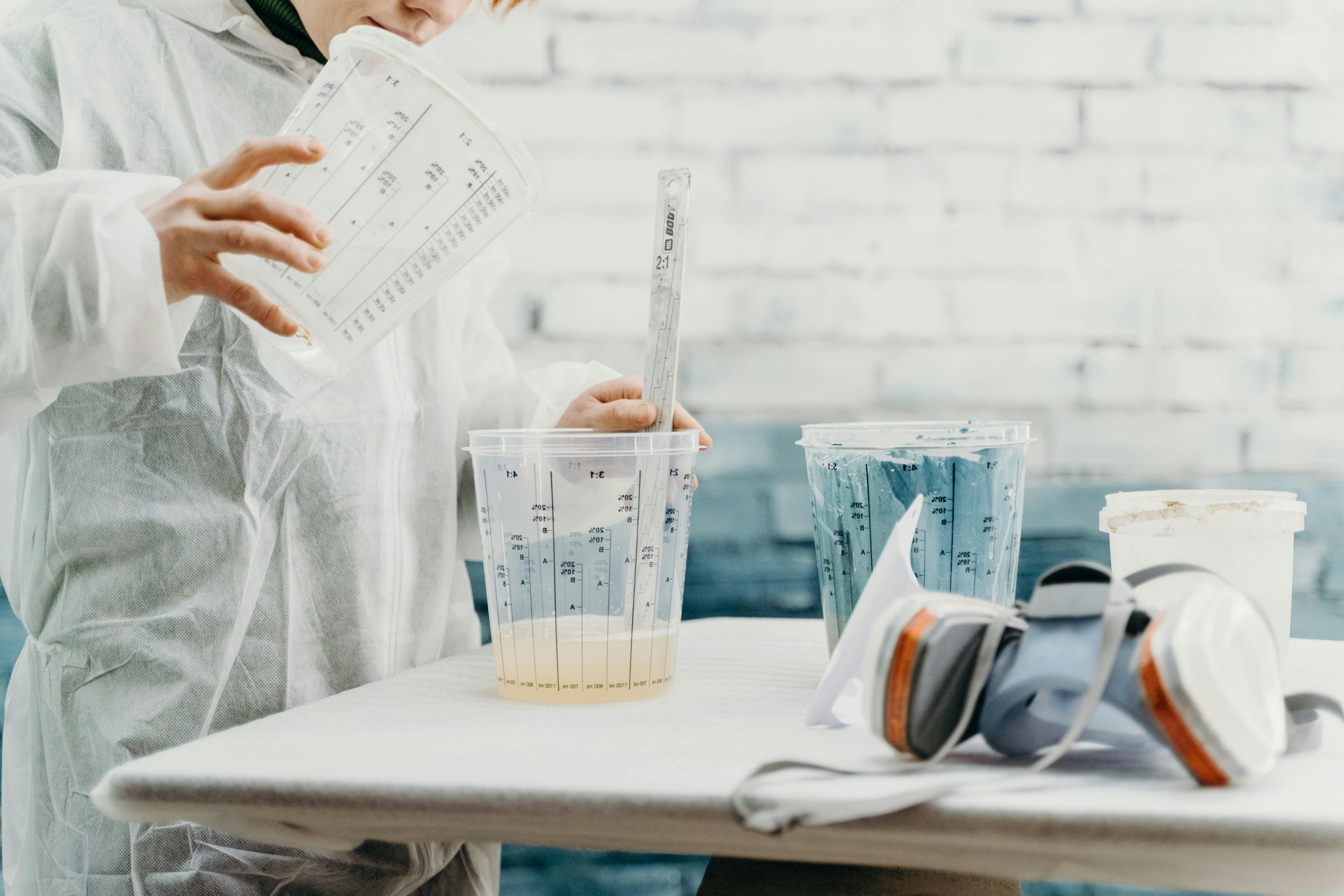 A Person Mixing Paint · Free Stock Photo