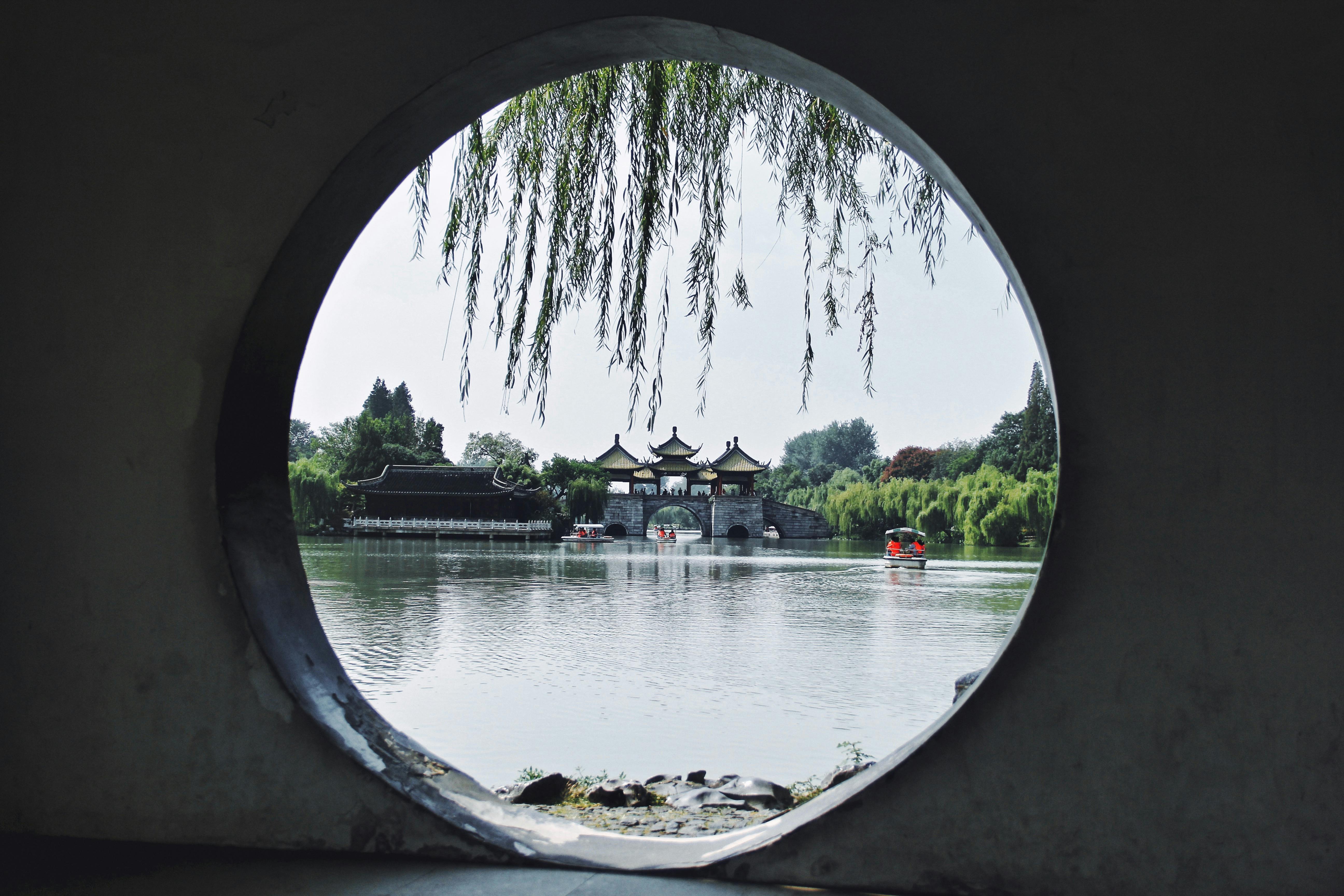 The View of the Wuting Bridge from a Hole in a Wall · Free Stock Photo