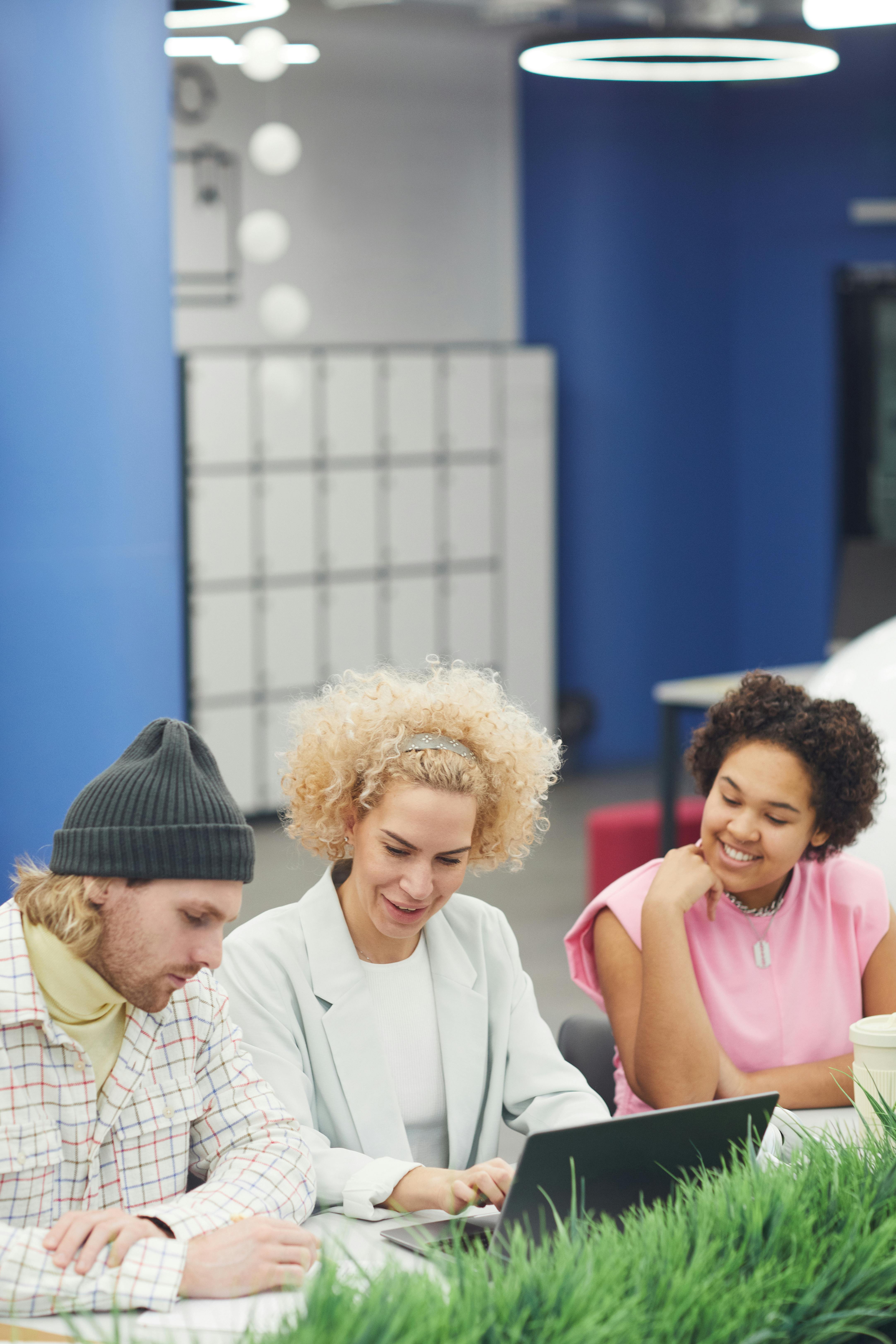 Three People Having Brainstorming At Work · Free Stock Photo