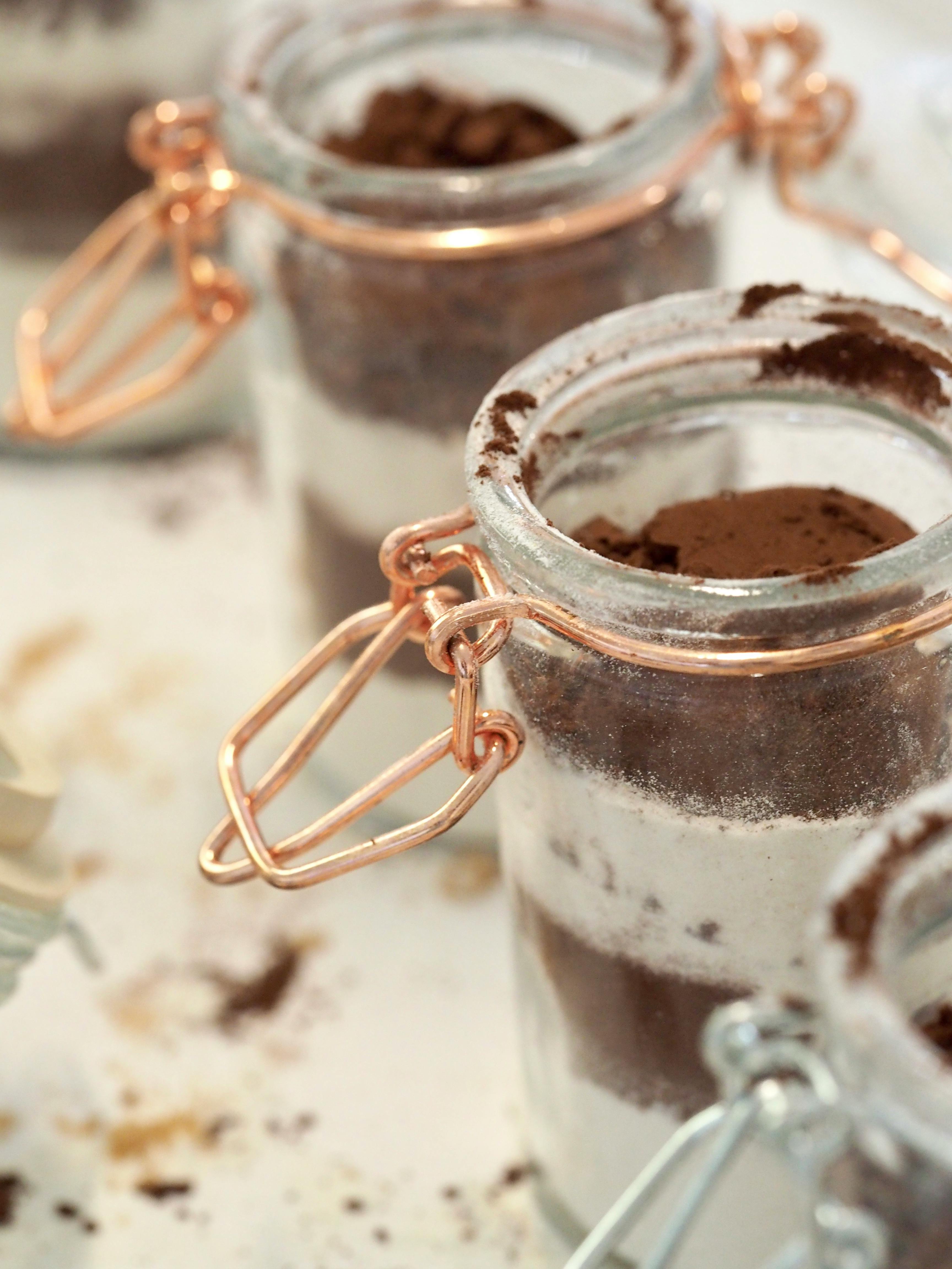 Cocoa powder with powdered sugar in glass jars · Free Stock Photo
