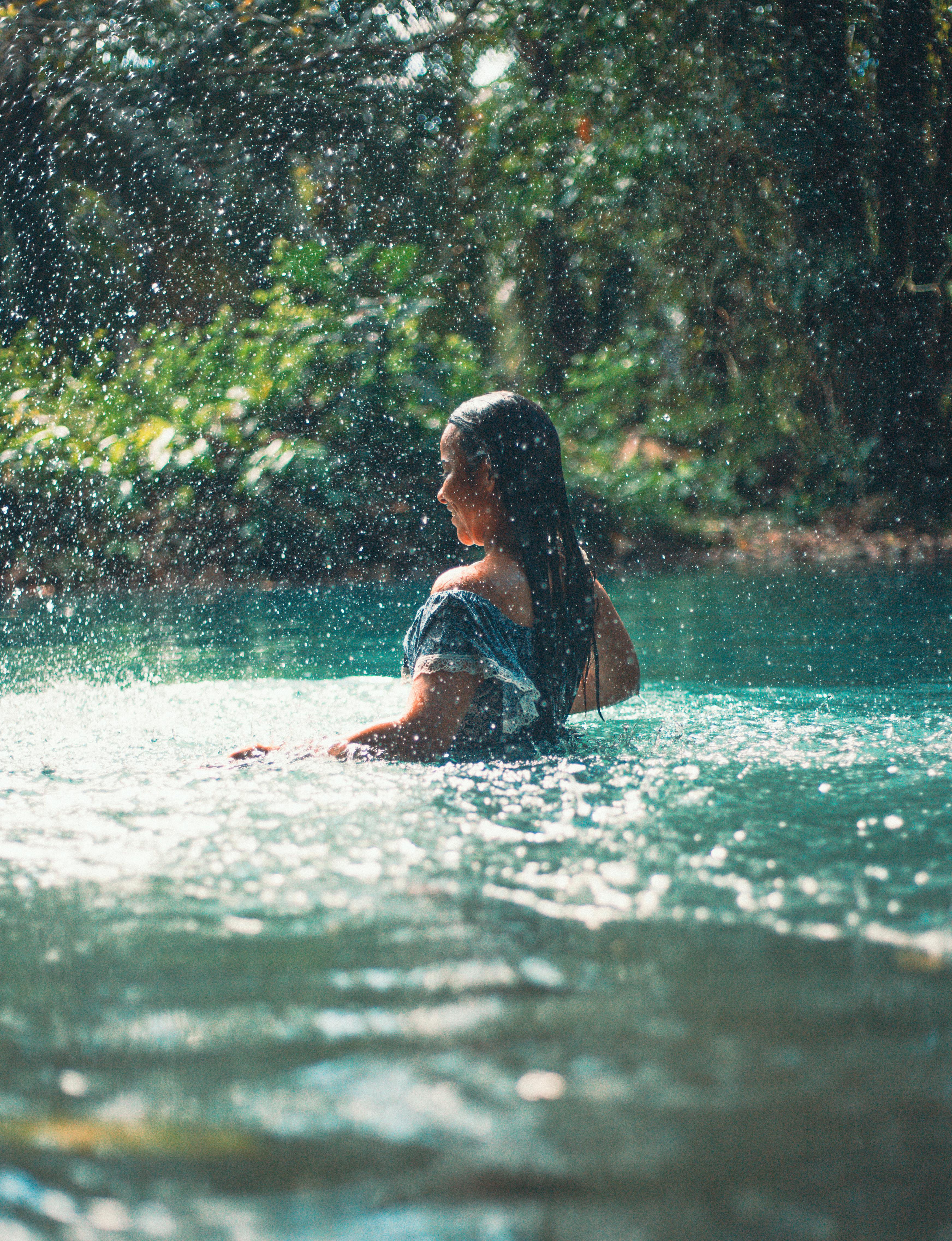A Woman Swimming in the Lagoon · Free Stock Photo