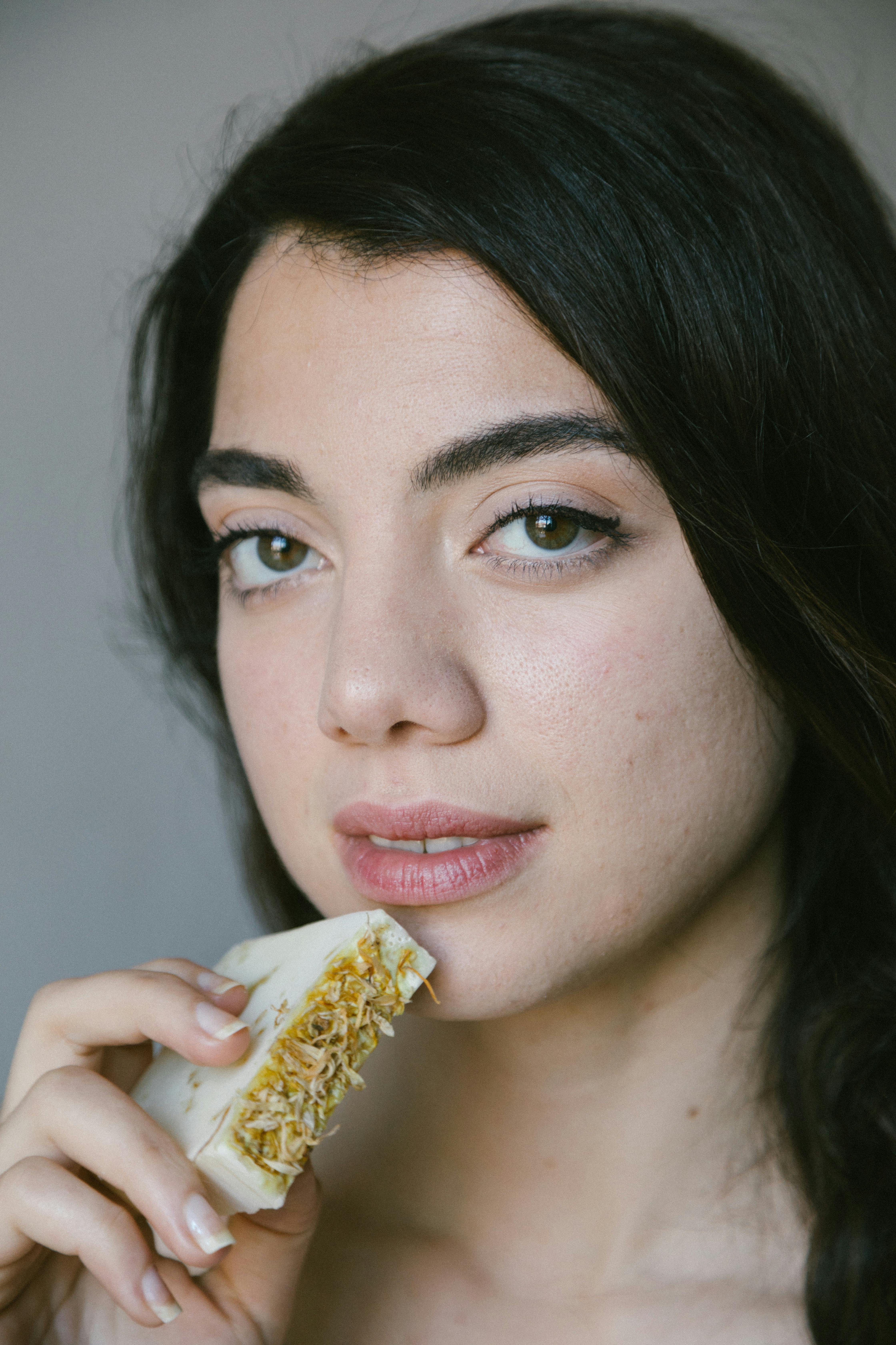 Woman Holding Oatmeal Bar Soap · Free Stock Photo