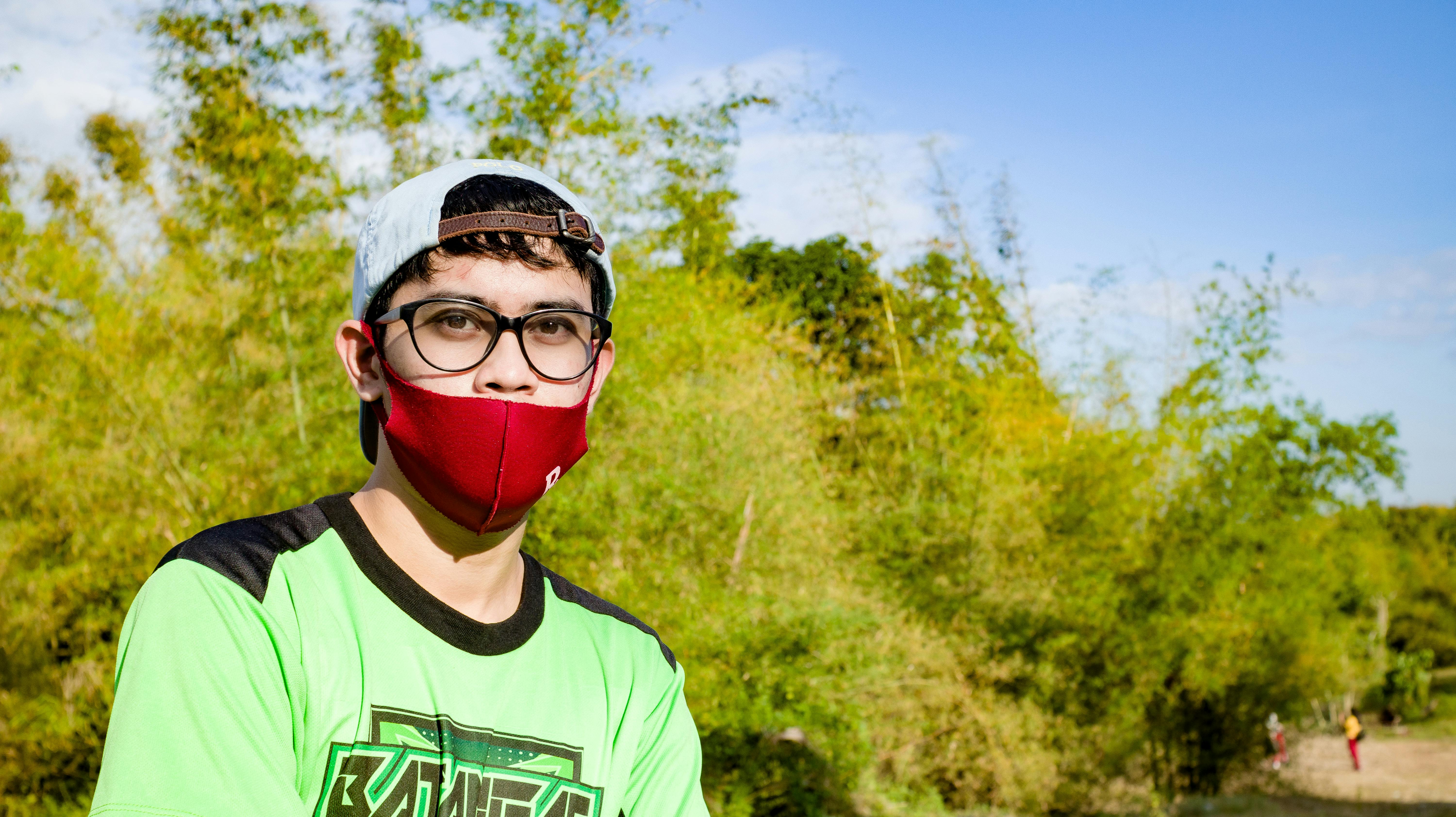 Ethnic man in red mask · Free Stock Photo