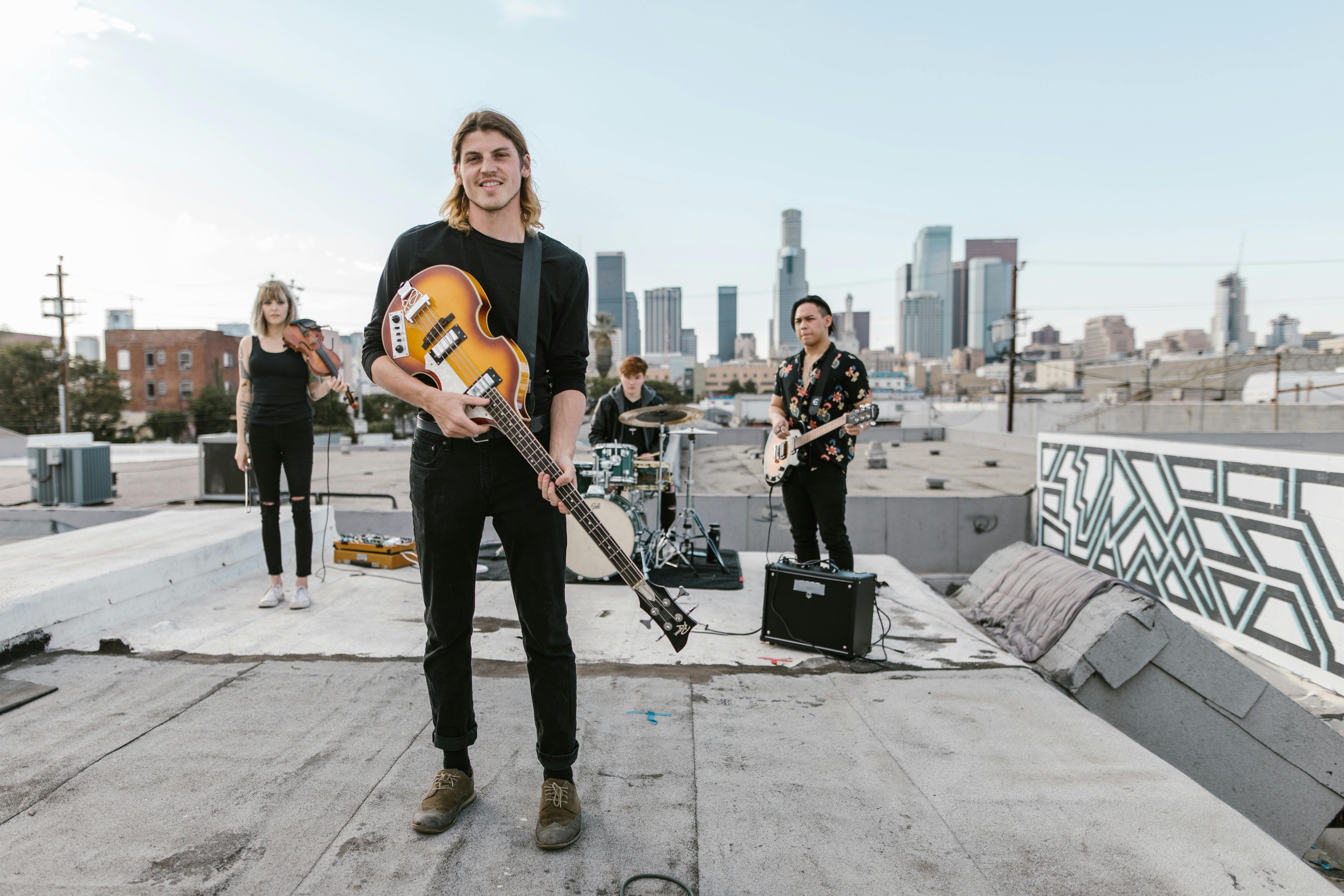 Man carrying an Electric Guitar · Free Stock Photo