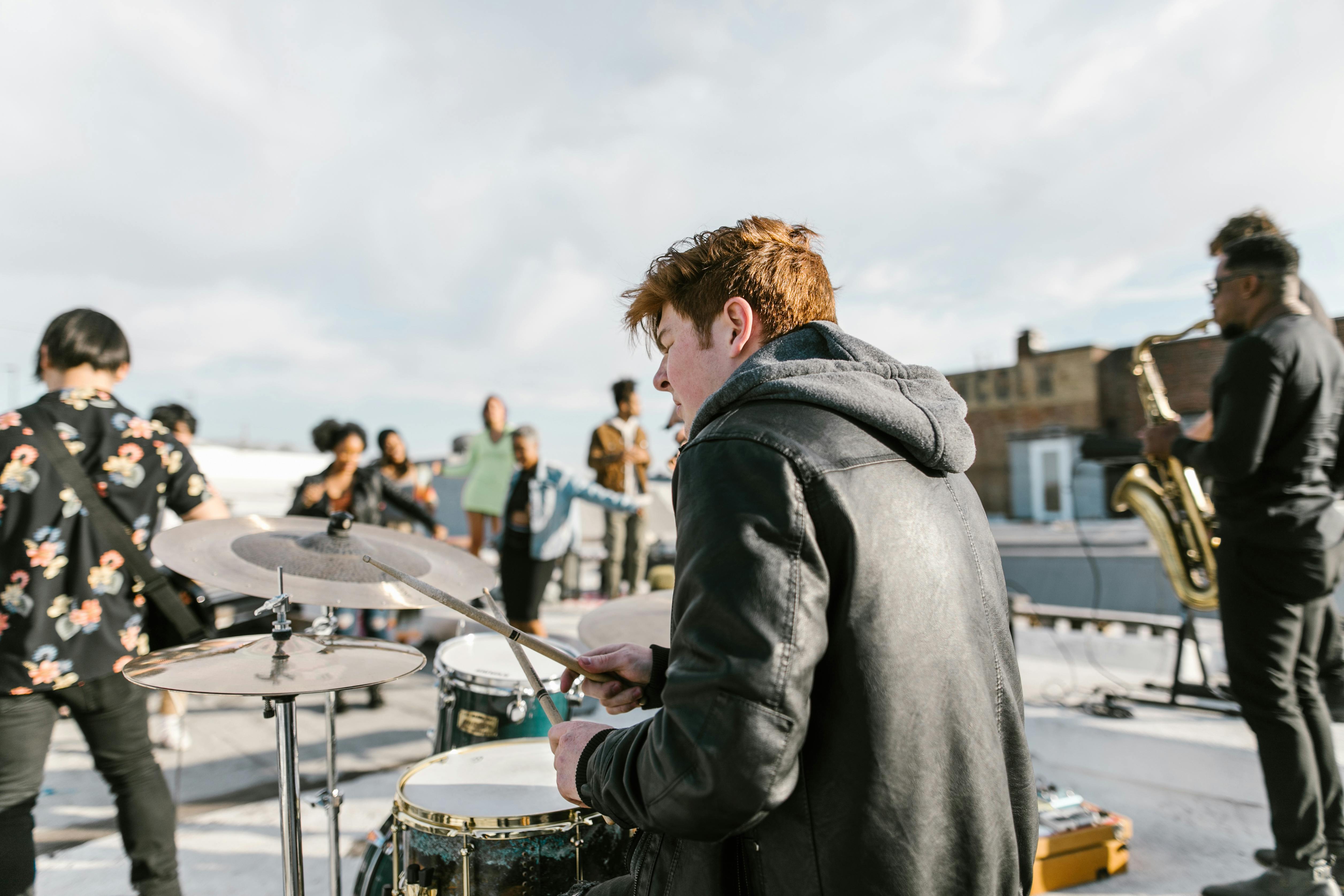 Back View of a Person Playing the Drums · Free Stock Photo