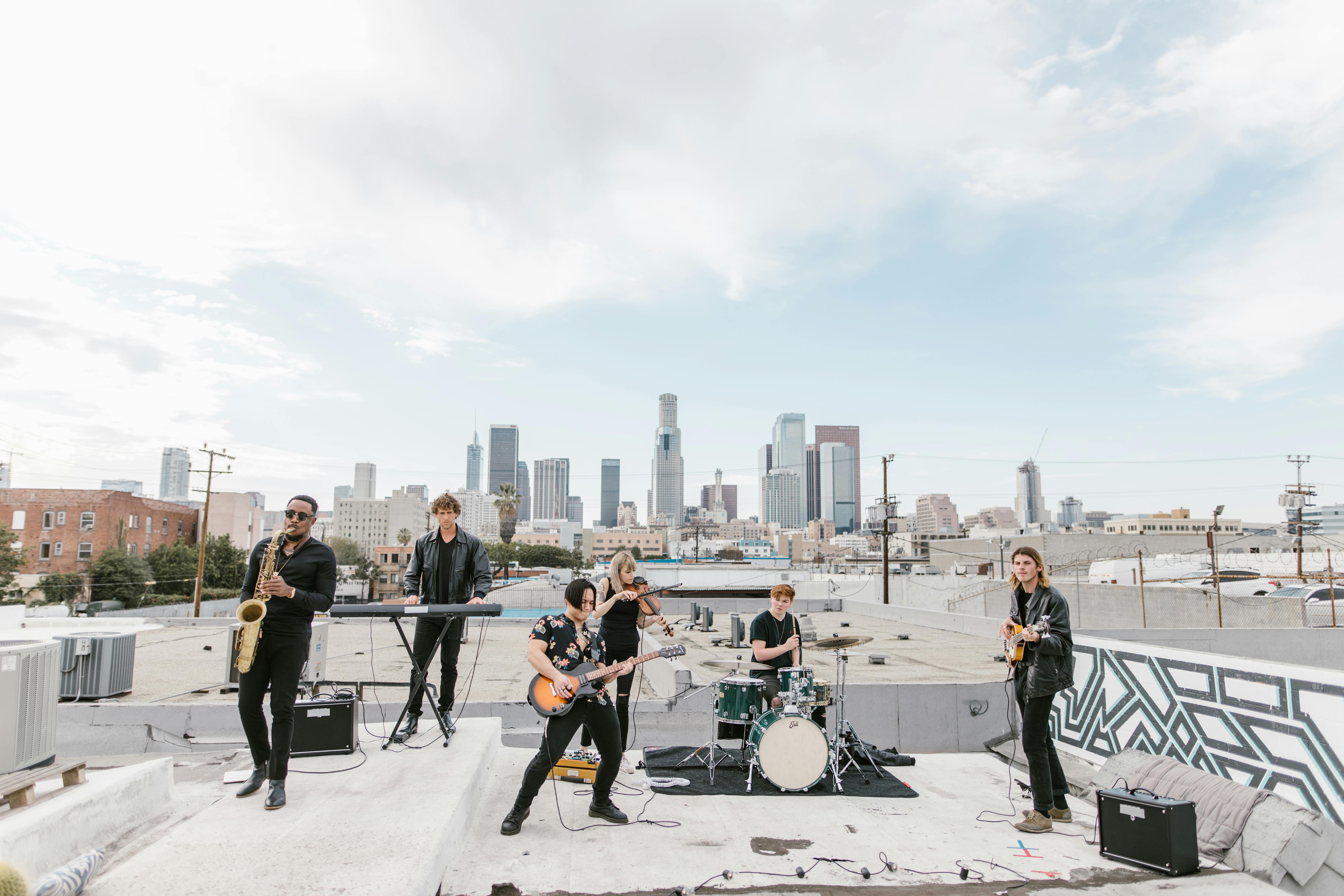 Music Band Playing on the Rooftop · Free Stock Photo