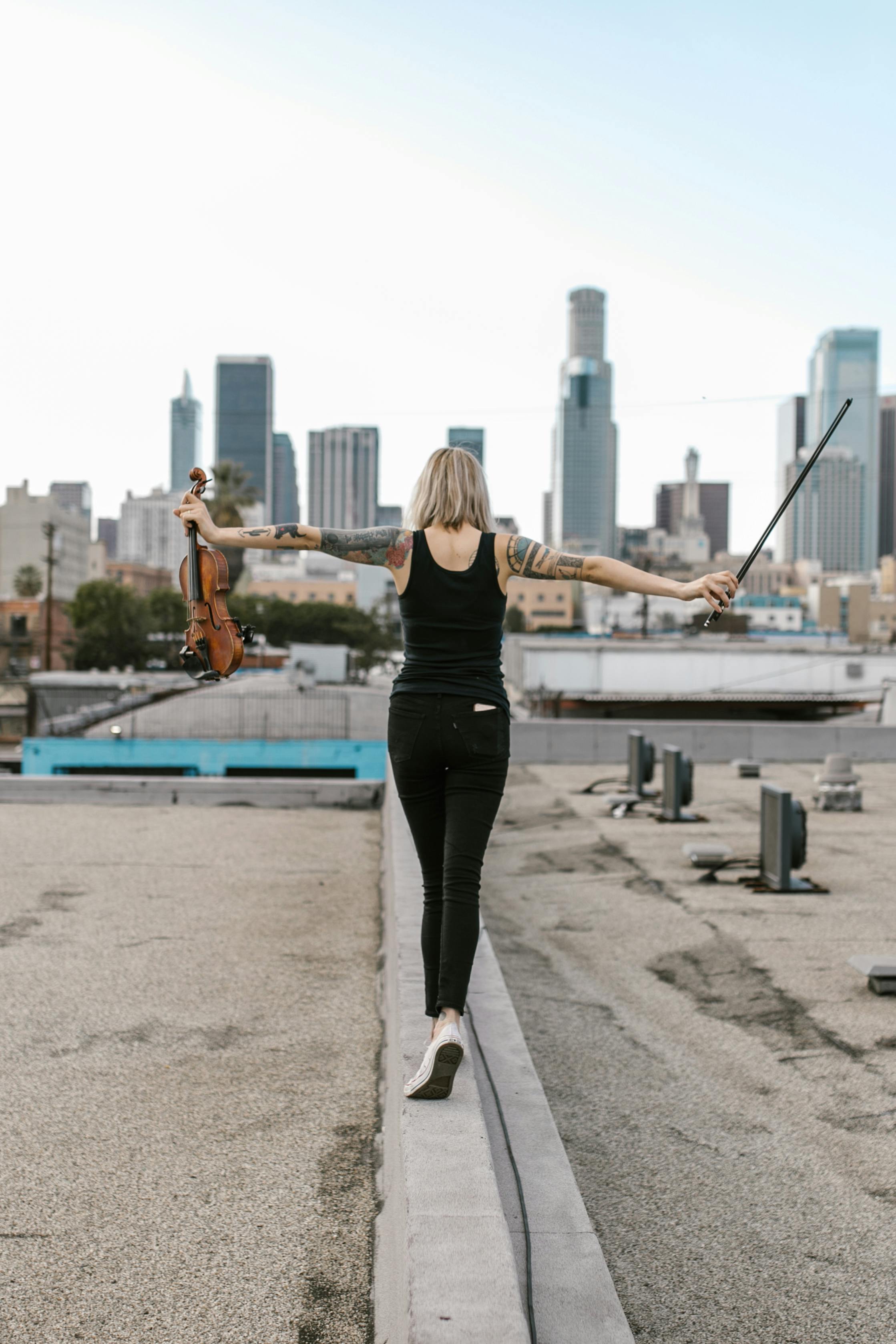 Back View of a Woman Tiptoeing over a Ledge · Free Stock Photo