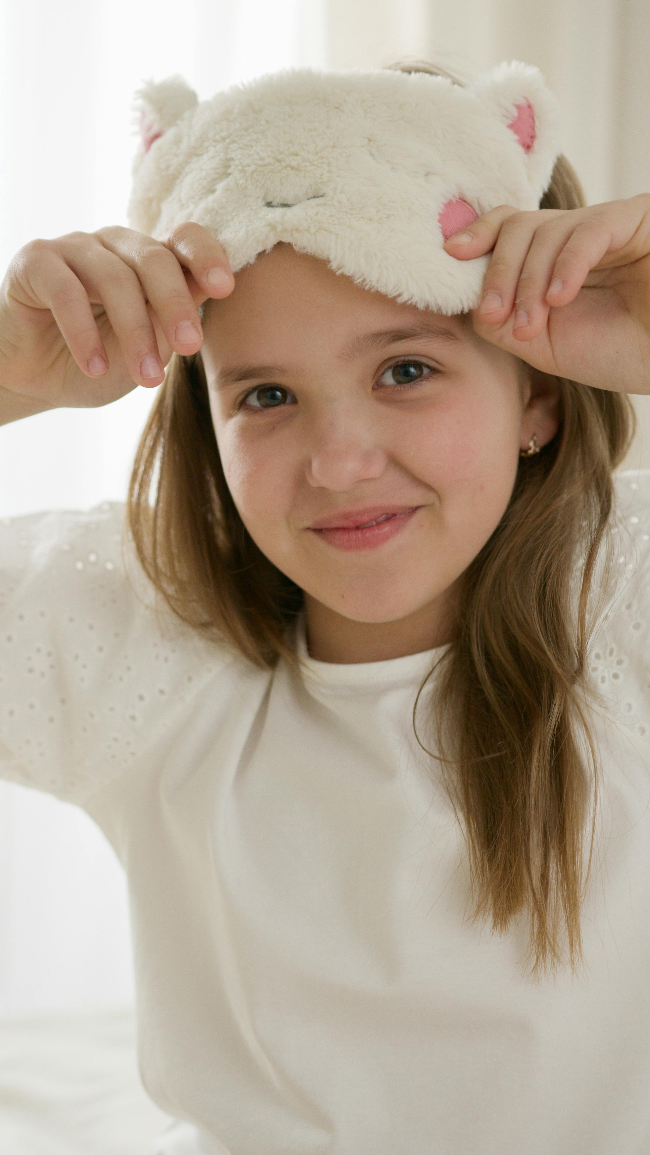 Close Up Photo of Cute Girl Holding Eye Mask · Free Stock Photo