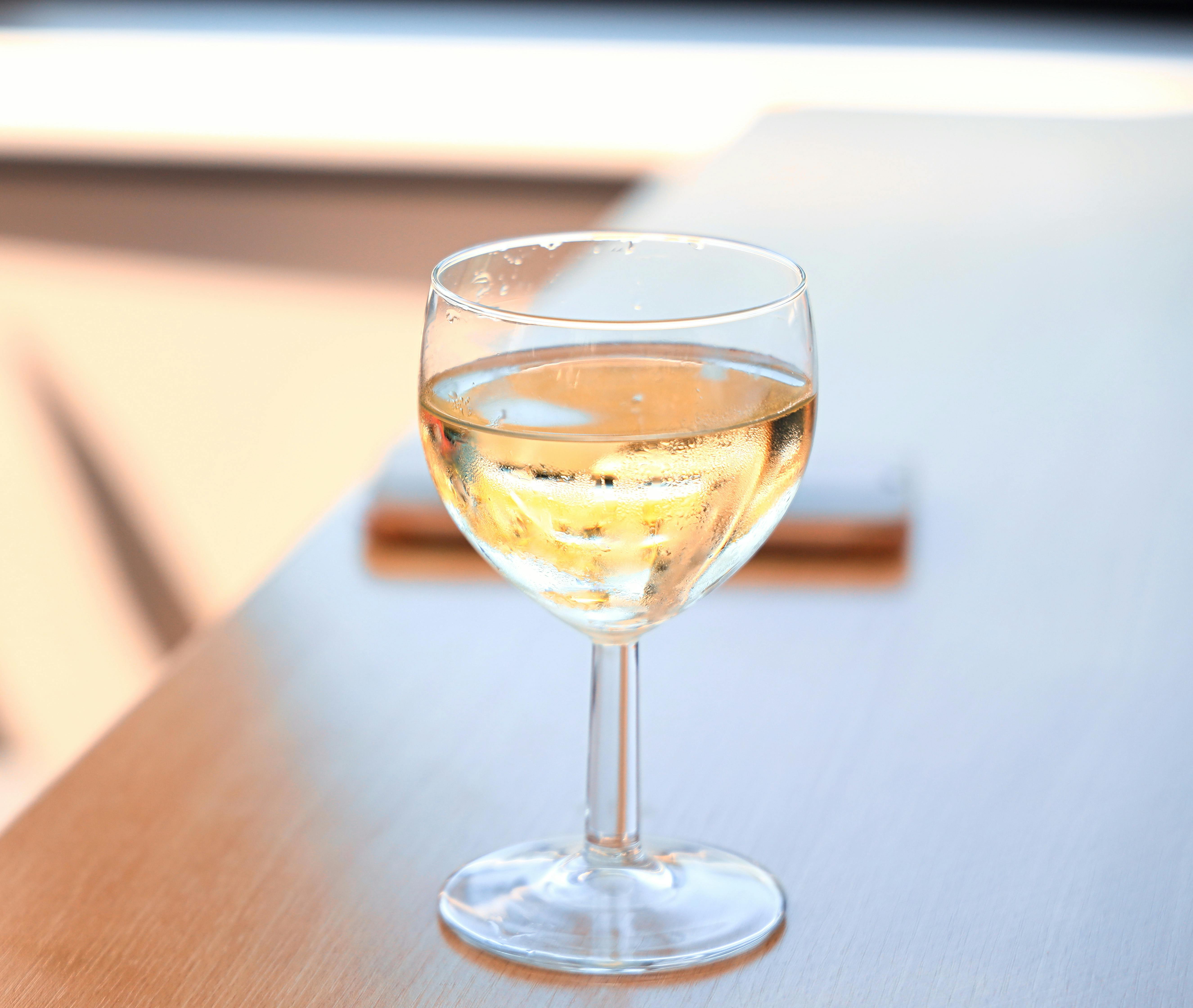 White Wine in a Glass and a Bottle · Free Stock Photo