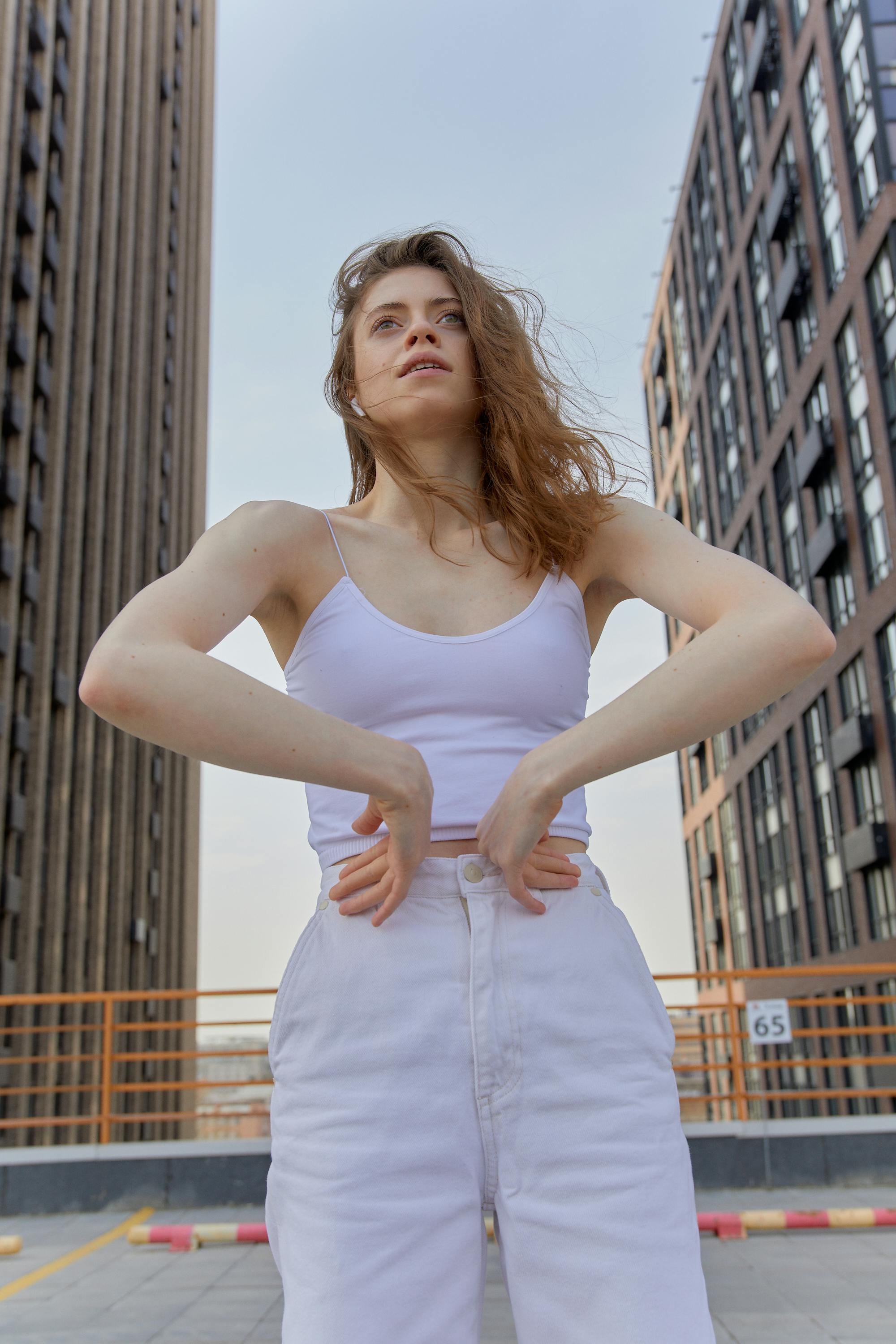Woman in White Tank Top and Pants Dancing · Free Stock Photo