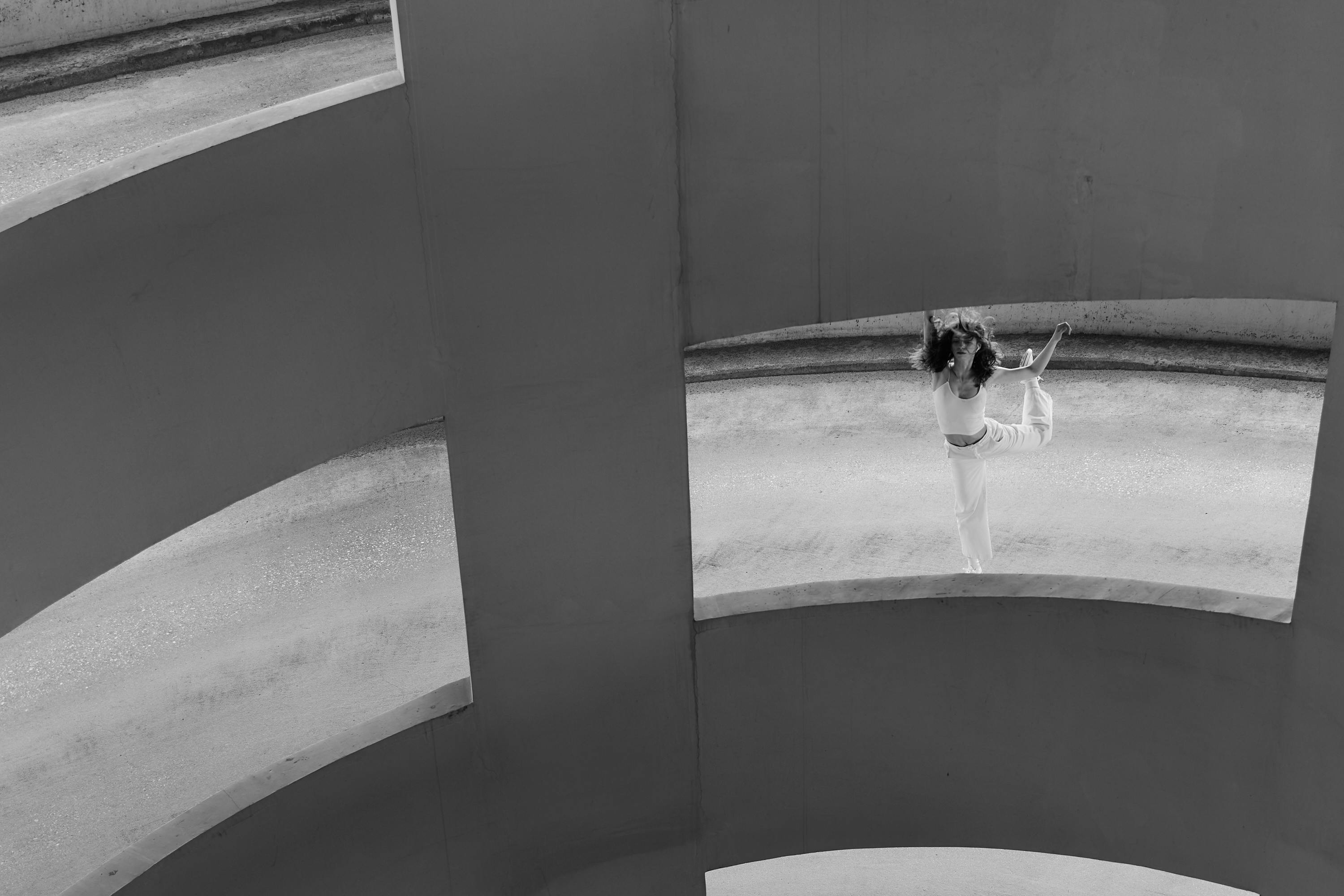 Woman Doing Ballet Dance on Side Walk in Grayscale Photo · Free Stock Photo