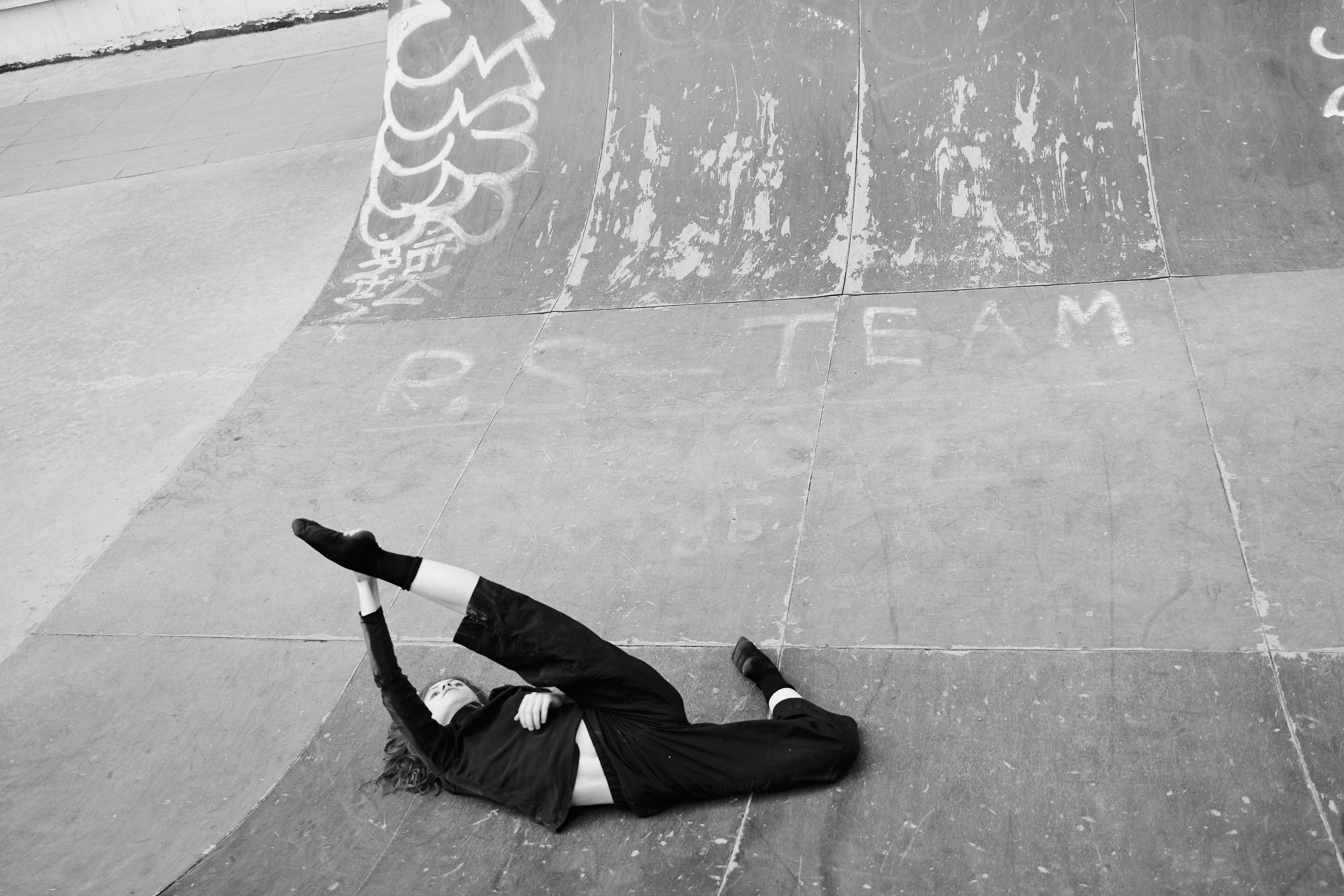 Flexible Woman Lying on the Floor · Free Stock Photo