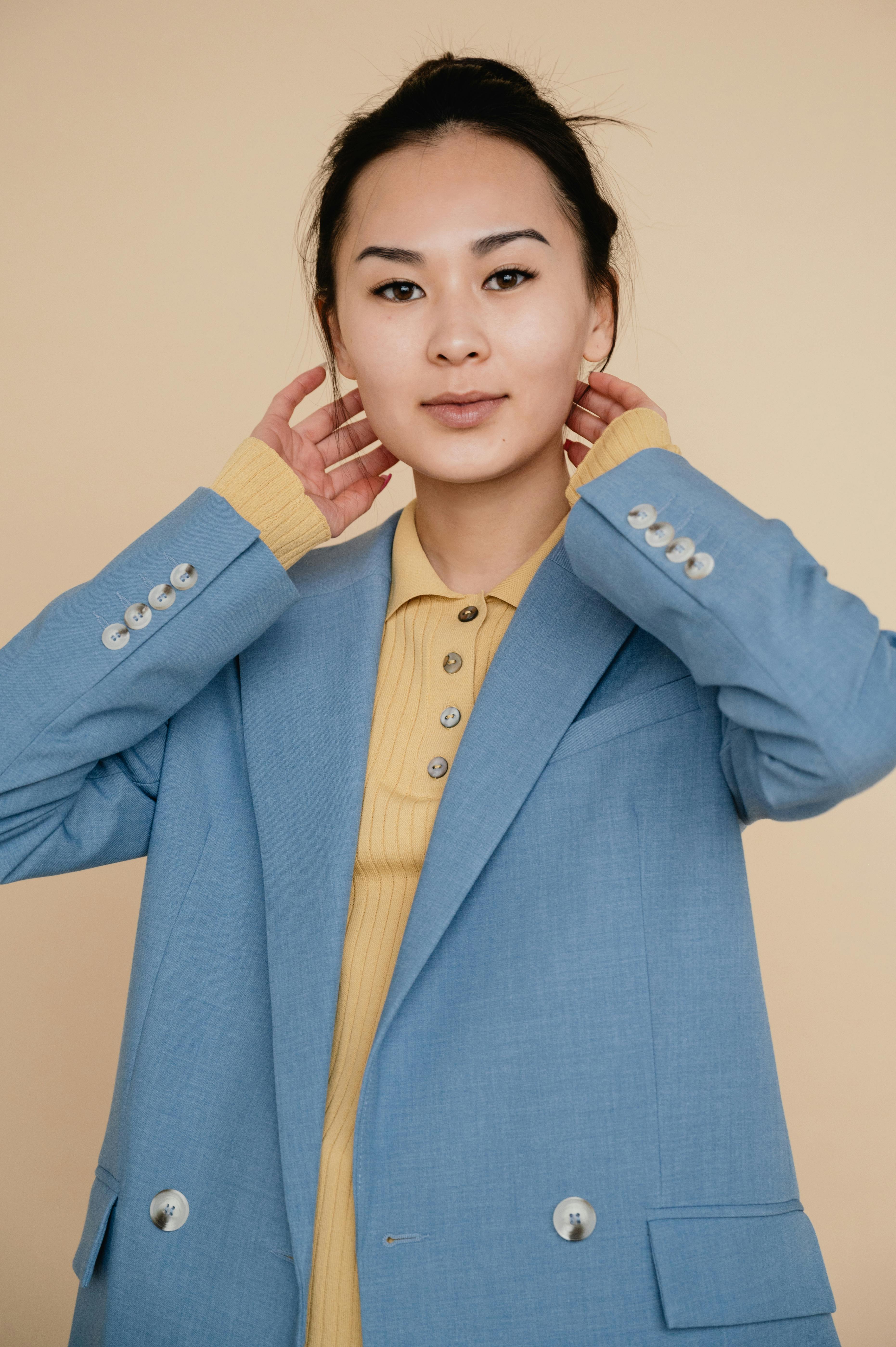 Portrait of a Woman Wearing a Blue Jacket · Free Stock Photo