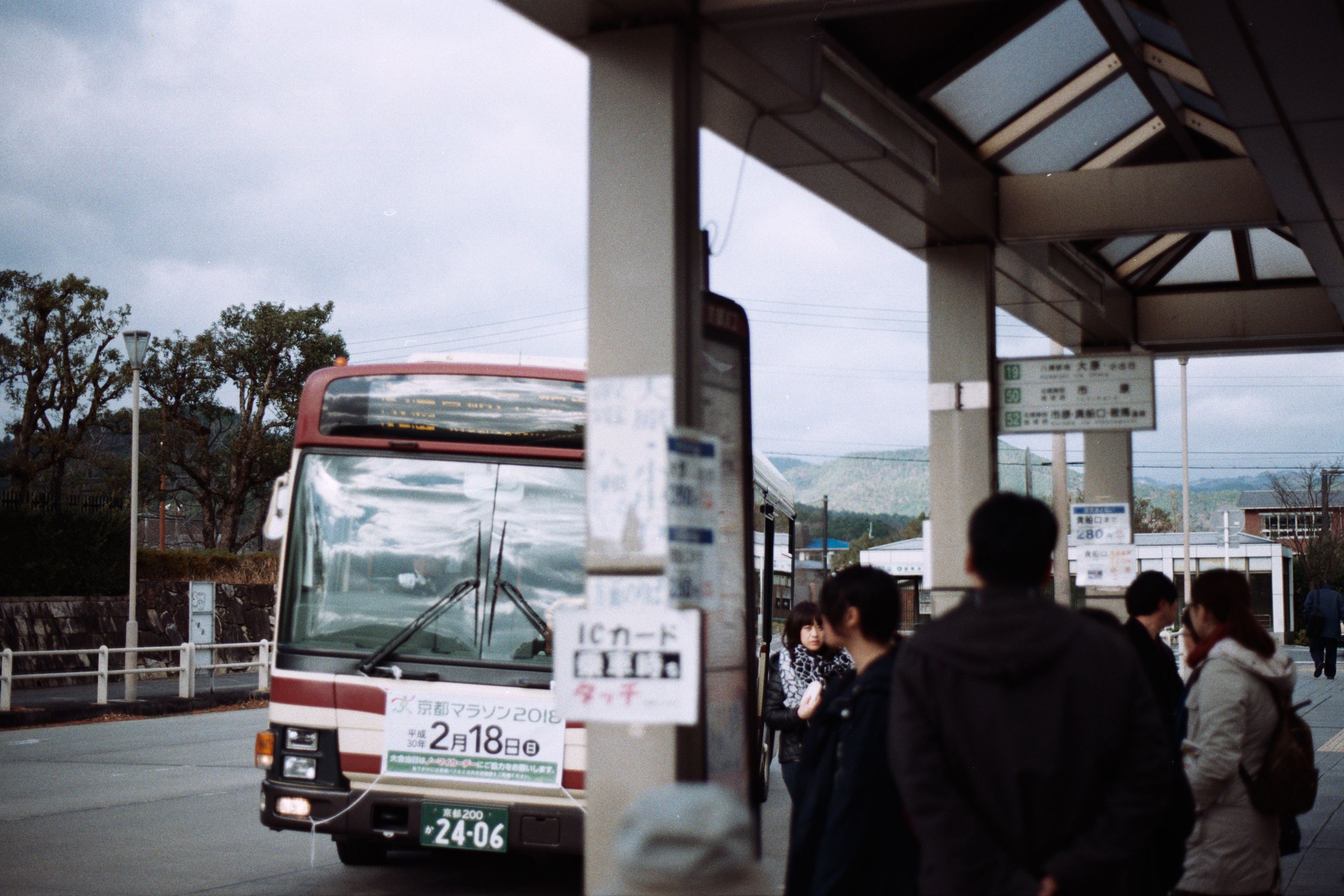 People Boarding the Bus in the Bus Stop · Free Stock Photo